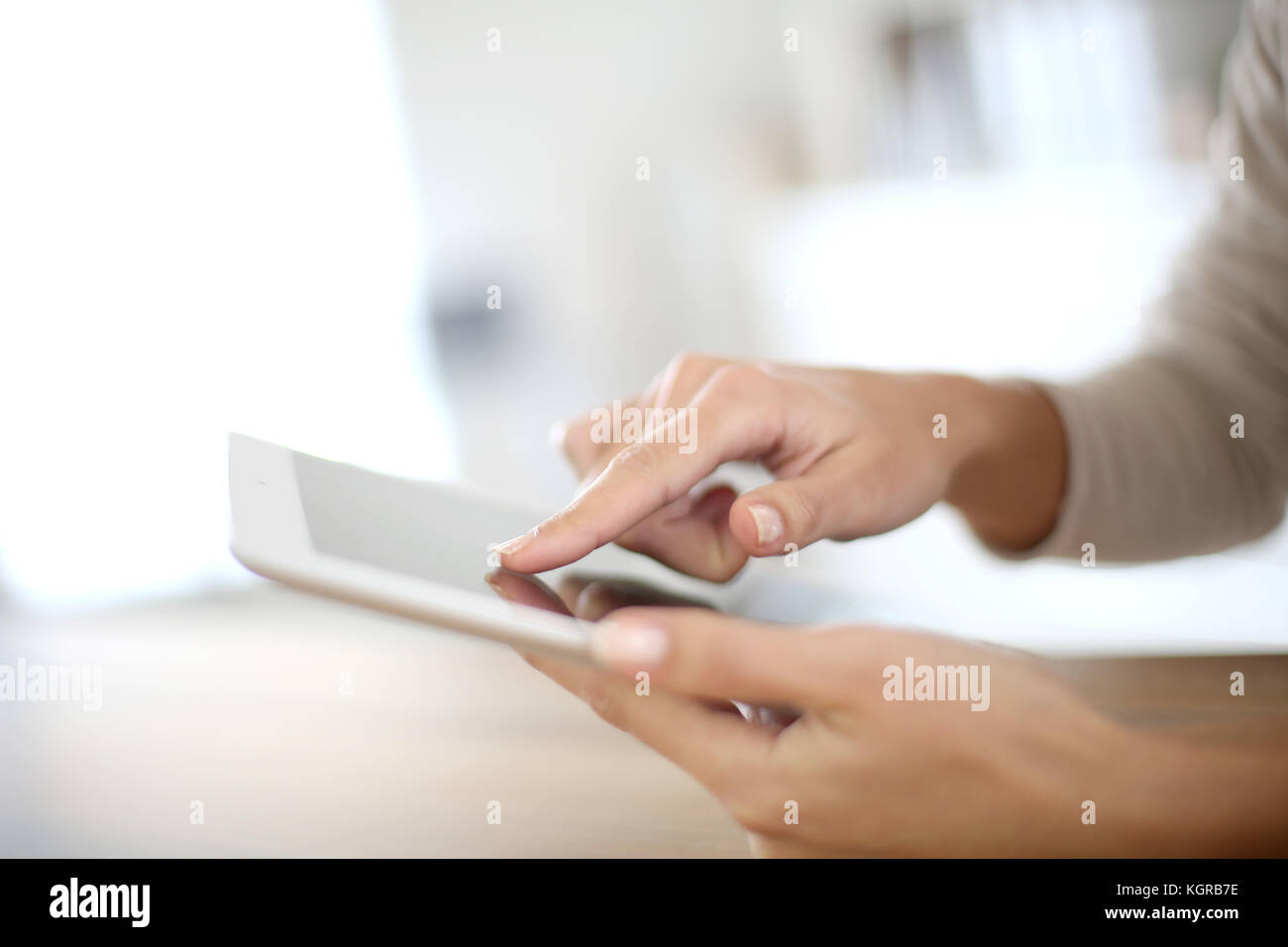 Closeup of woman's hand sliding on tablet screen Stock Photo - Alamy
