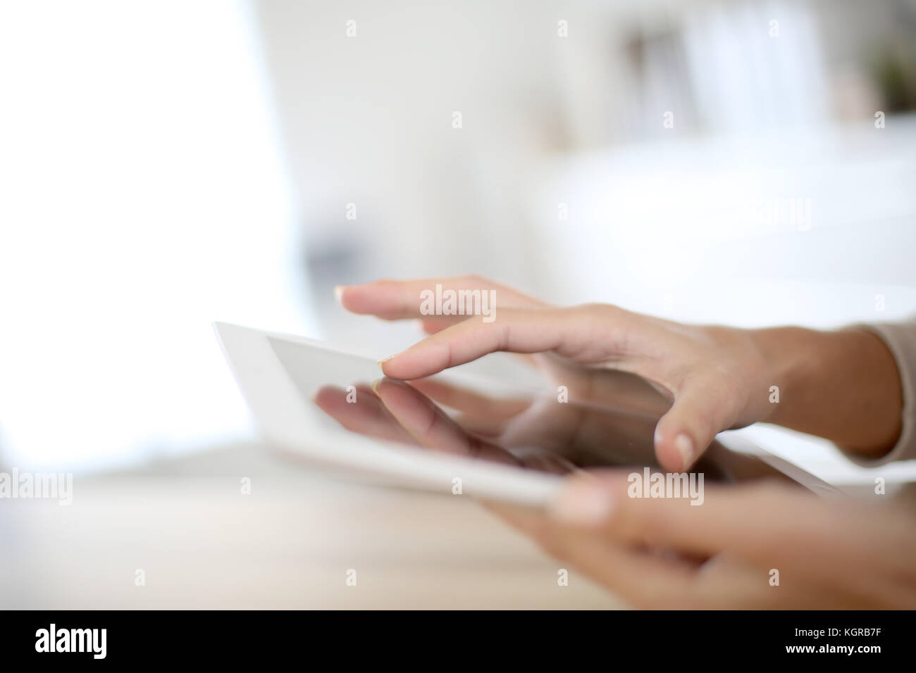 Closeup of woman's hand sliding on tablet screen Stock Photo - Alamy