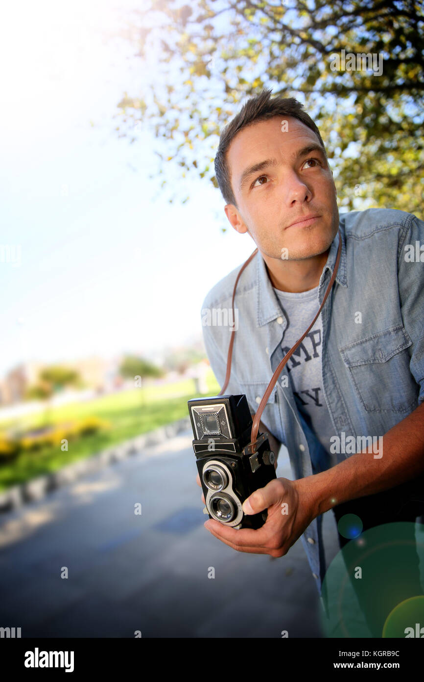 Photographer using vintage camera Stock Photo - Alamy