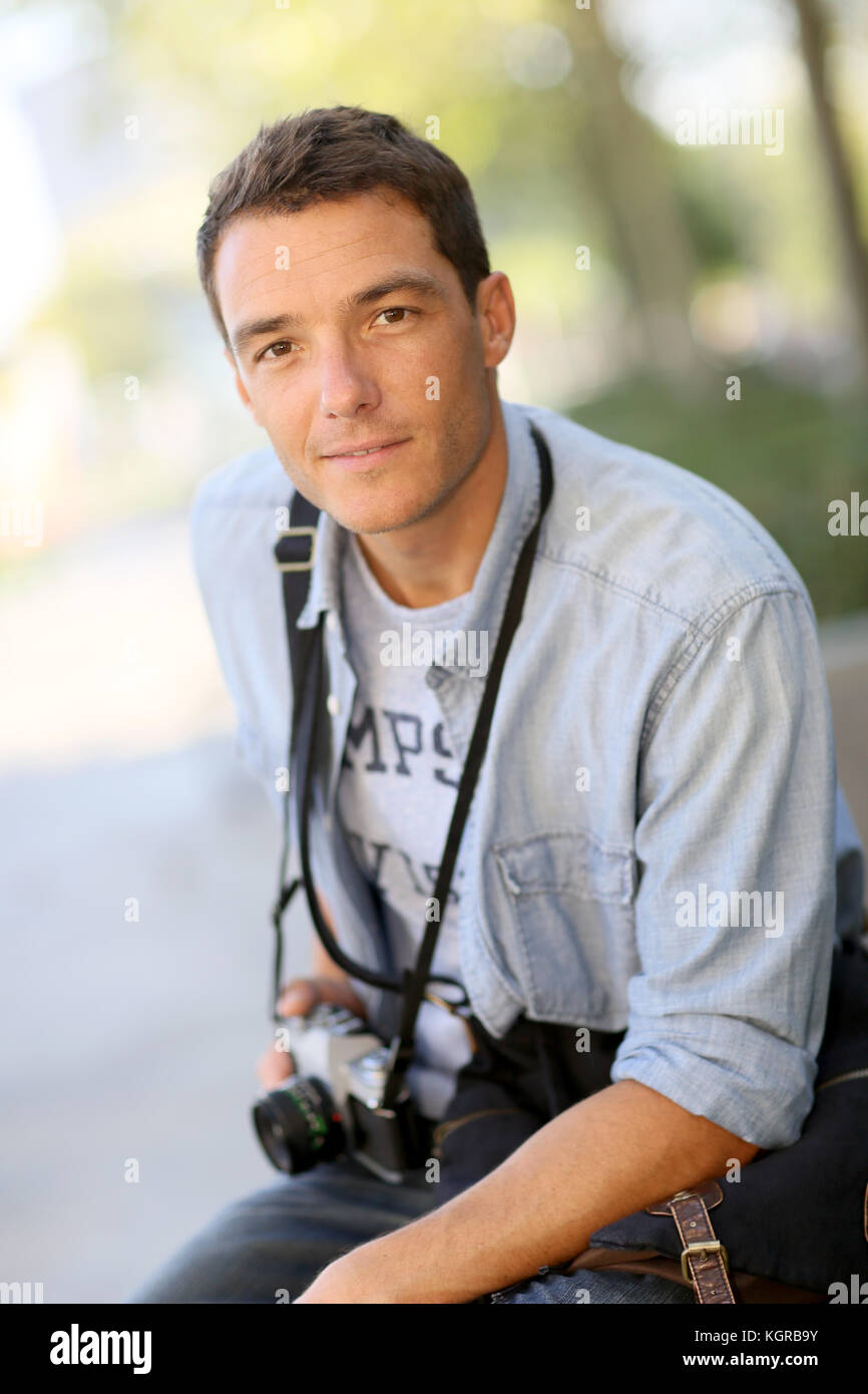 Photographer shooting outside with old camera Stock Photo - Alamy