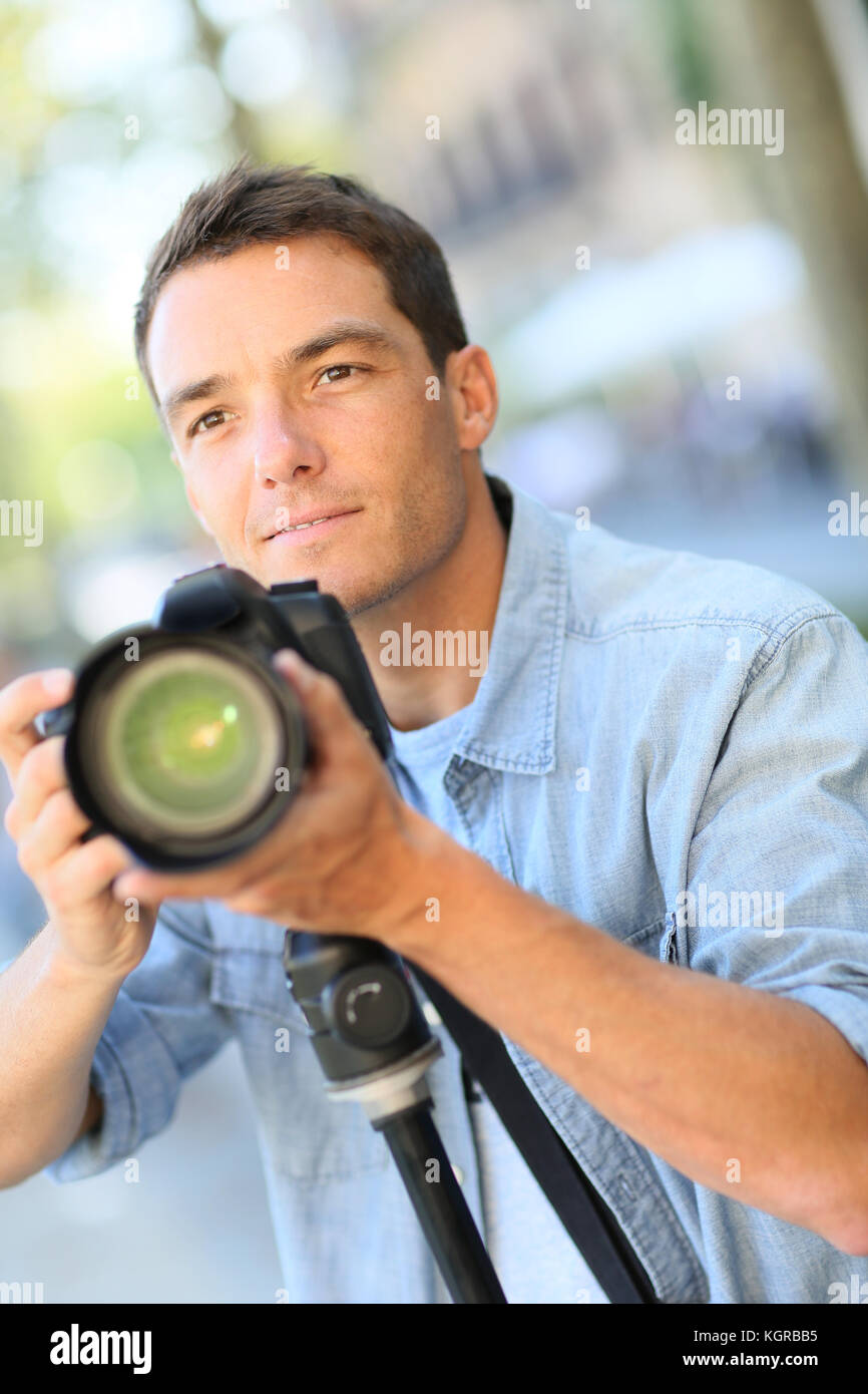 Photographer on a shooting session outside Stock Photo - Alamy