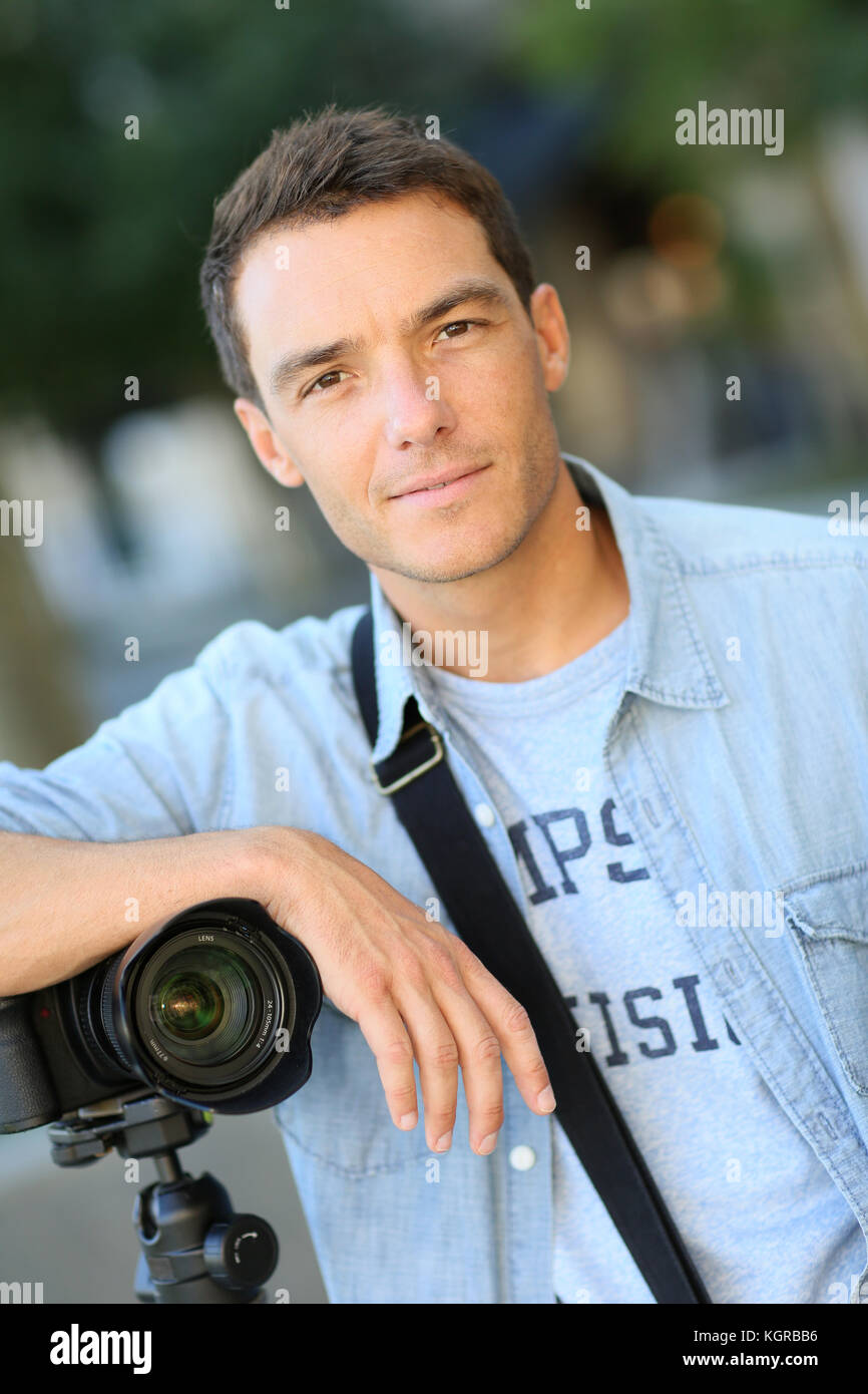 Photographer on a shooting session outside Stock Photo - Alamy