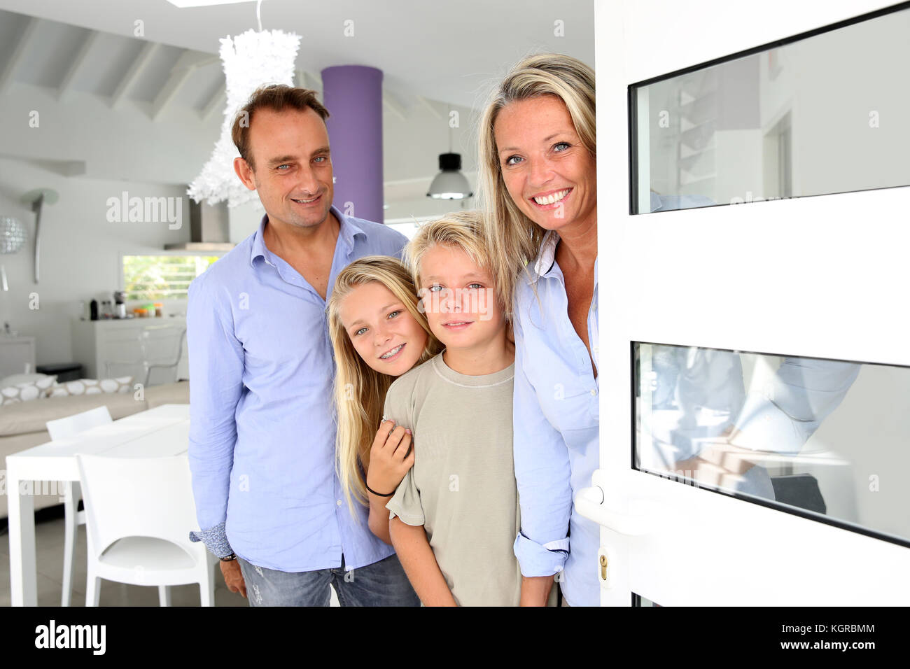 Happy family welcoming people at home Stock Photo - Alamy Happy family welcoming people at home Stock Photo - Alamy
