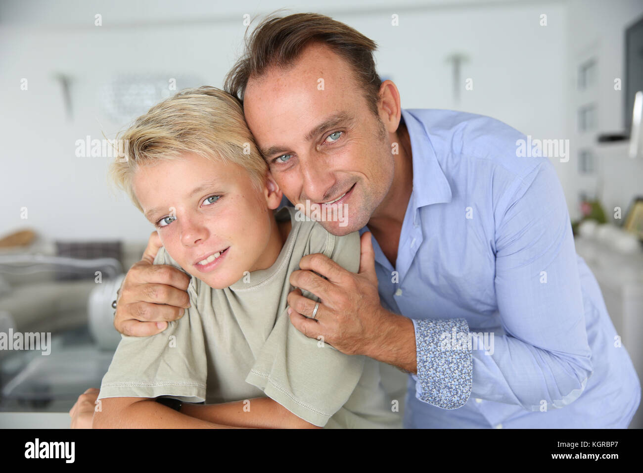 Portrait of father embracing son Stock Photo - Alamy
