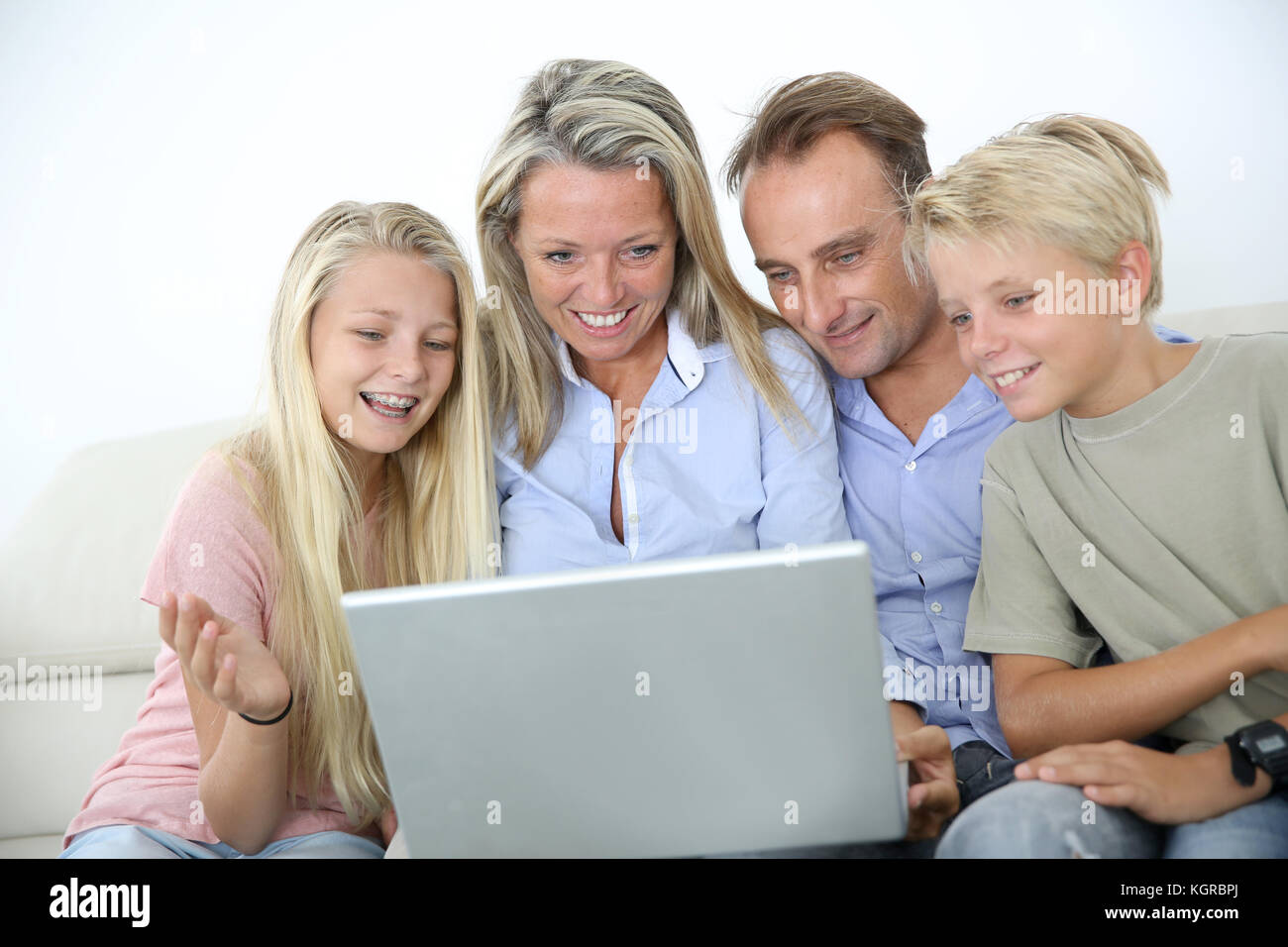 Family connected on internet with laptop Stock Photo - Alamy