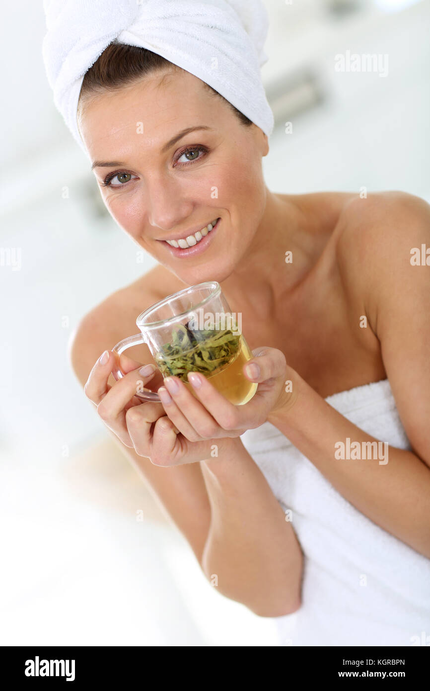 Portrait of beautiful woman drinking herbal tea Stock Photo - Alamy