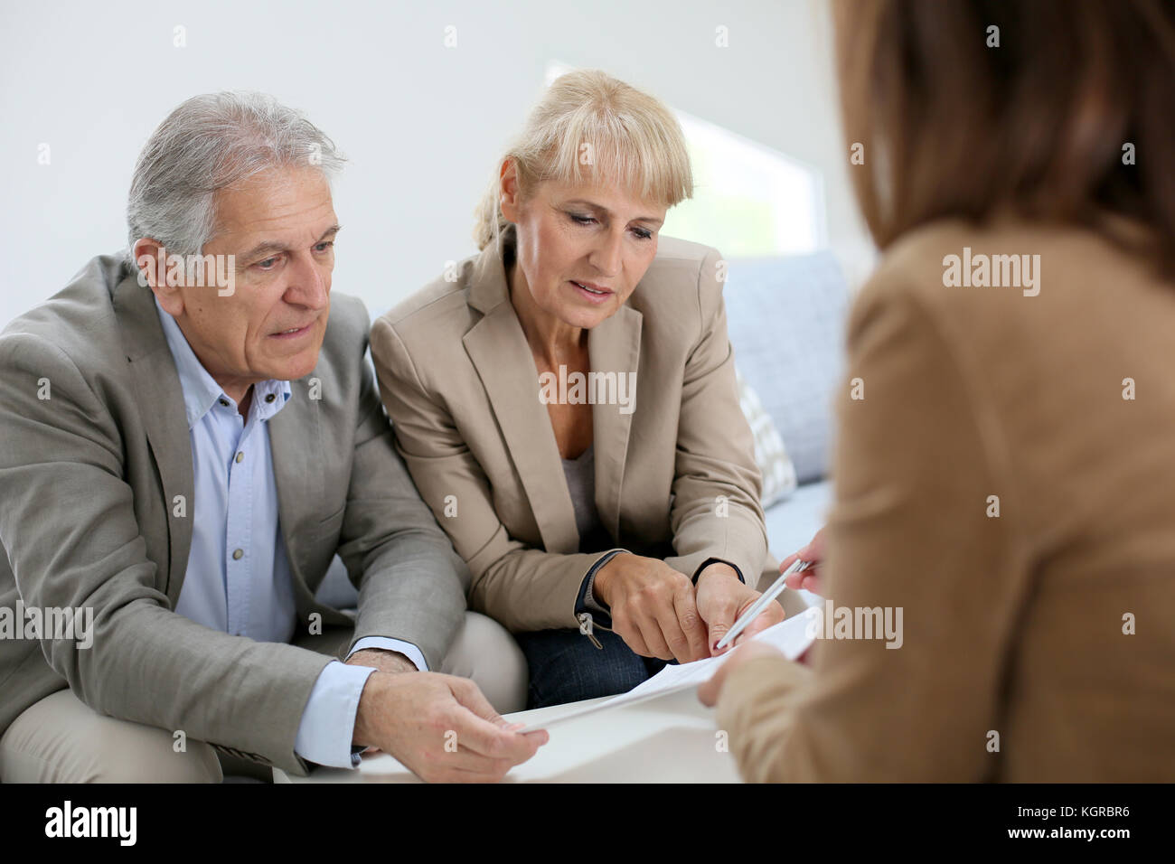 Senior couple meeting real estate agent Stock Photo - Alamy