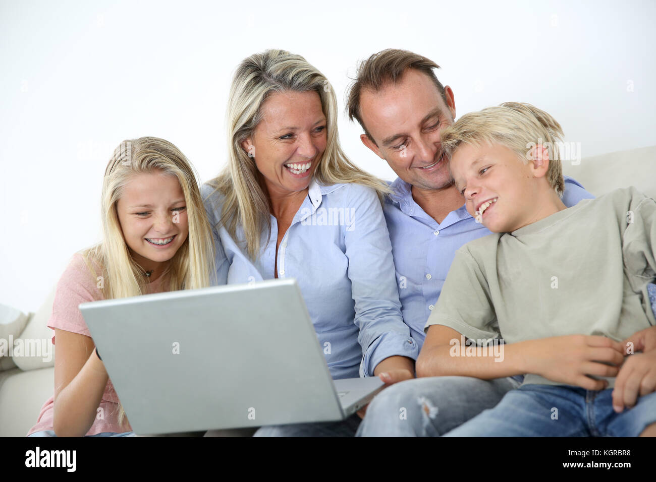 Family connected on internet with laptop Stock Photo - Alamy