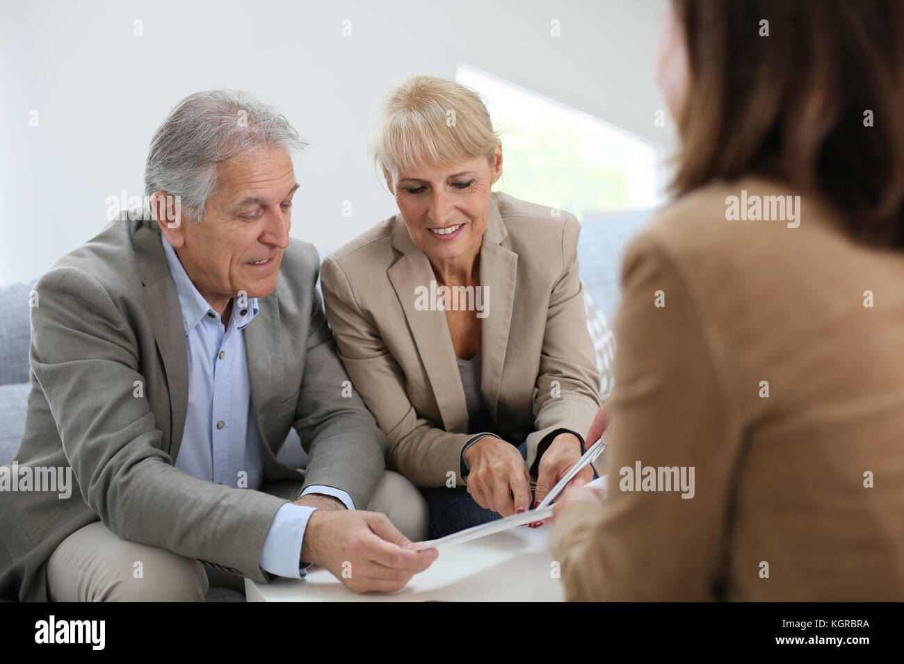 Senior couple meeting real estate agent Stock Photo - Alamy