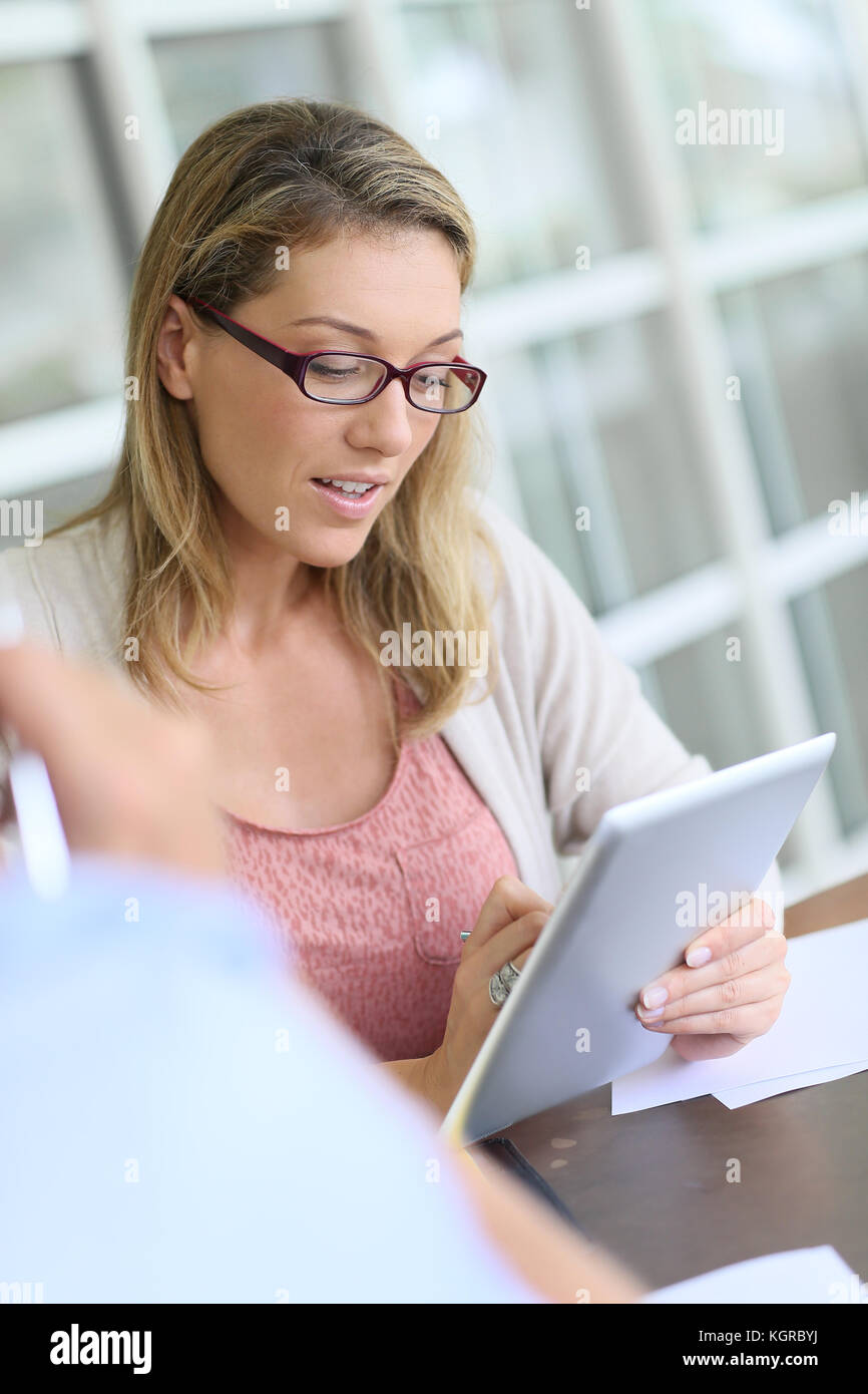 Businesswoman meeting client in office Stock Photo - Alamy