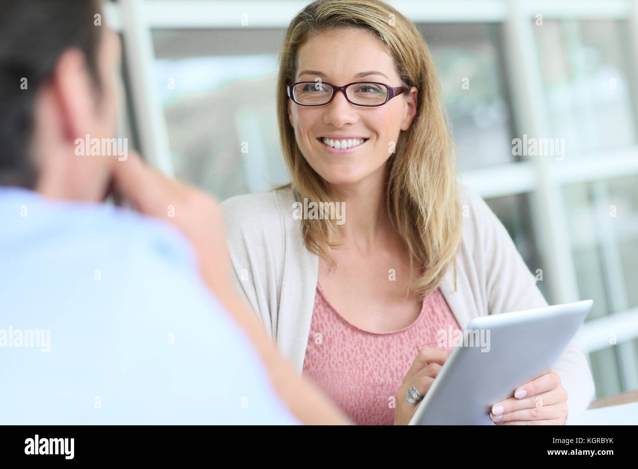 Businesswoman meeting client in office Stock Photo - Alamy