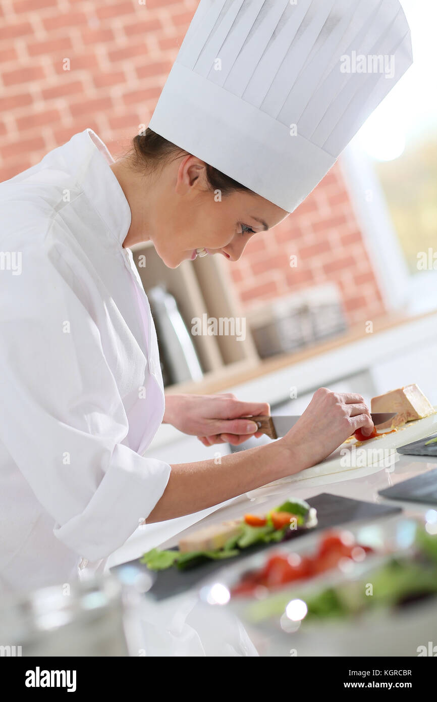 Smiling cook preparing appetizer Stock Photo - Alamy