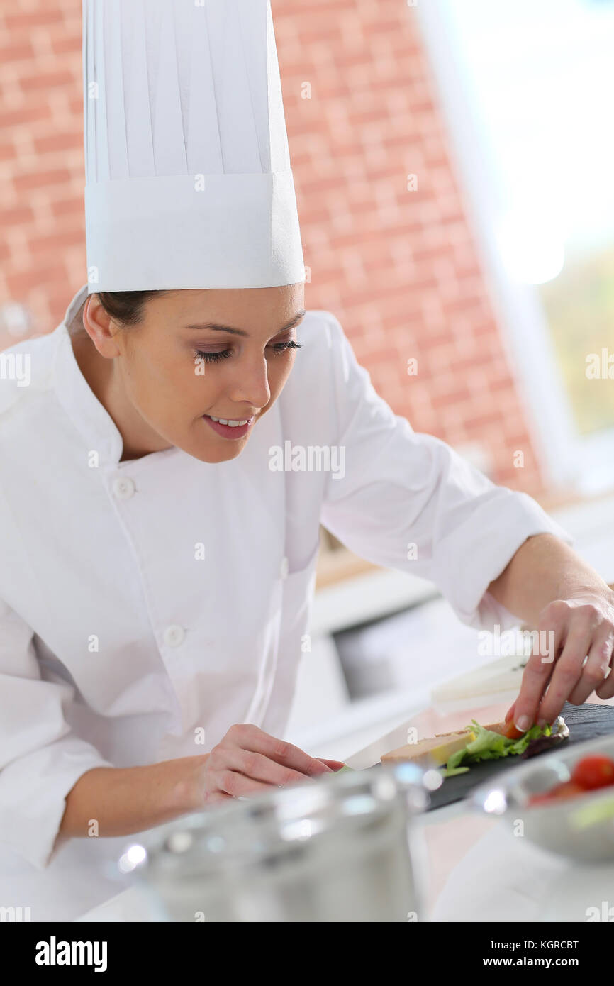 Smiling cook preparing appetizer Stock Photo - Alamy