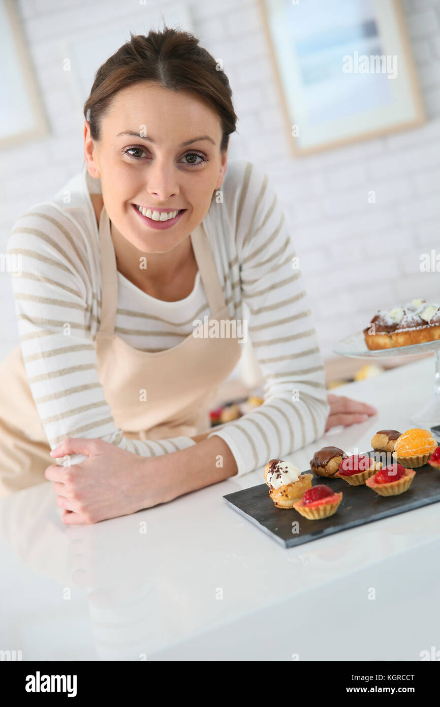Smiling girl working chocolate hi-res stock photography and images - Alamy