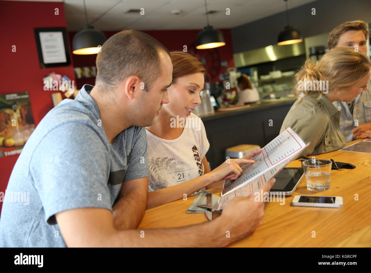 Students at lunch time choosing dish from menu Stock Photo - Alamy