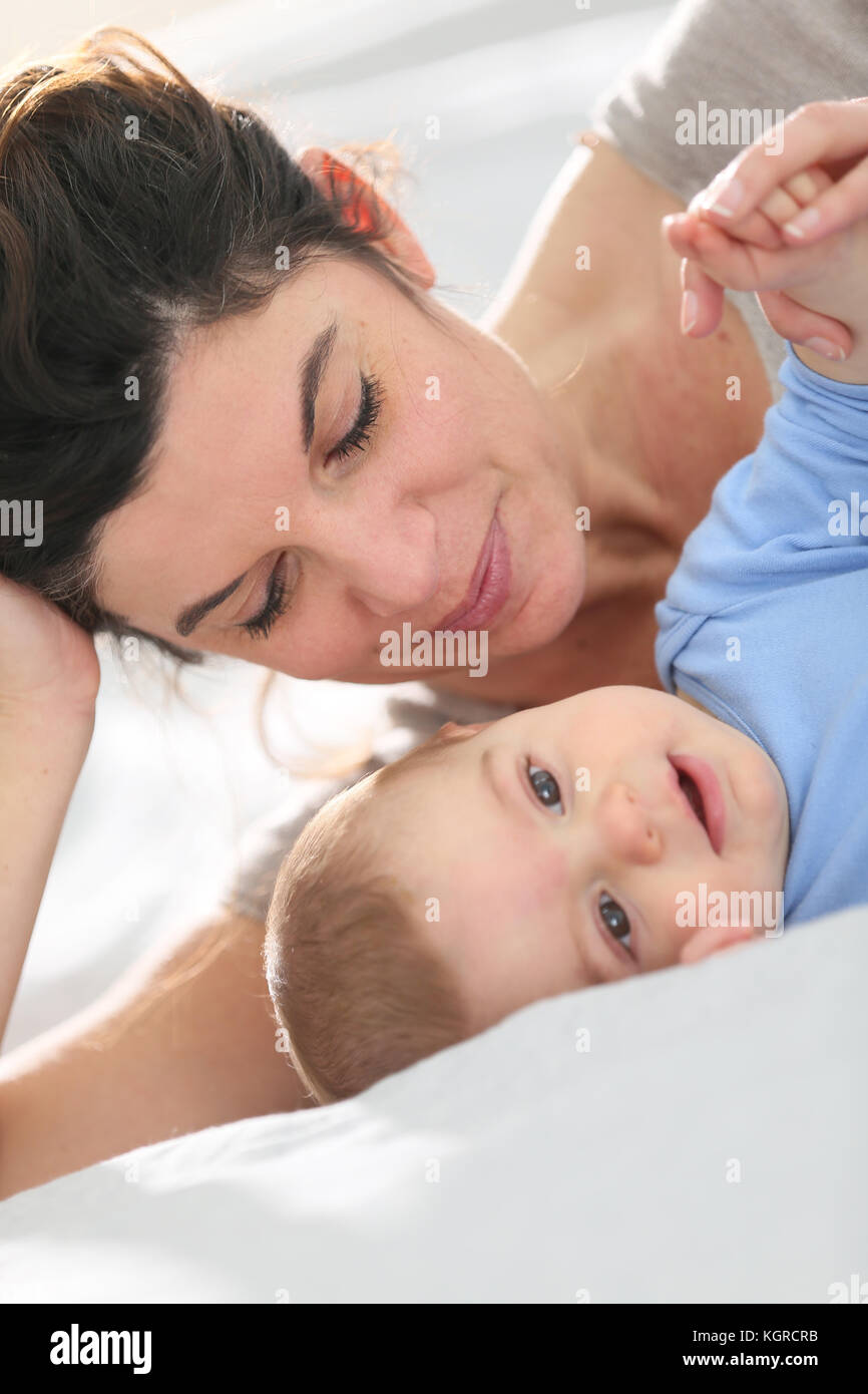 Mother cuddling baby hi-res stock photography and images - Alamy