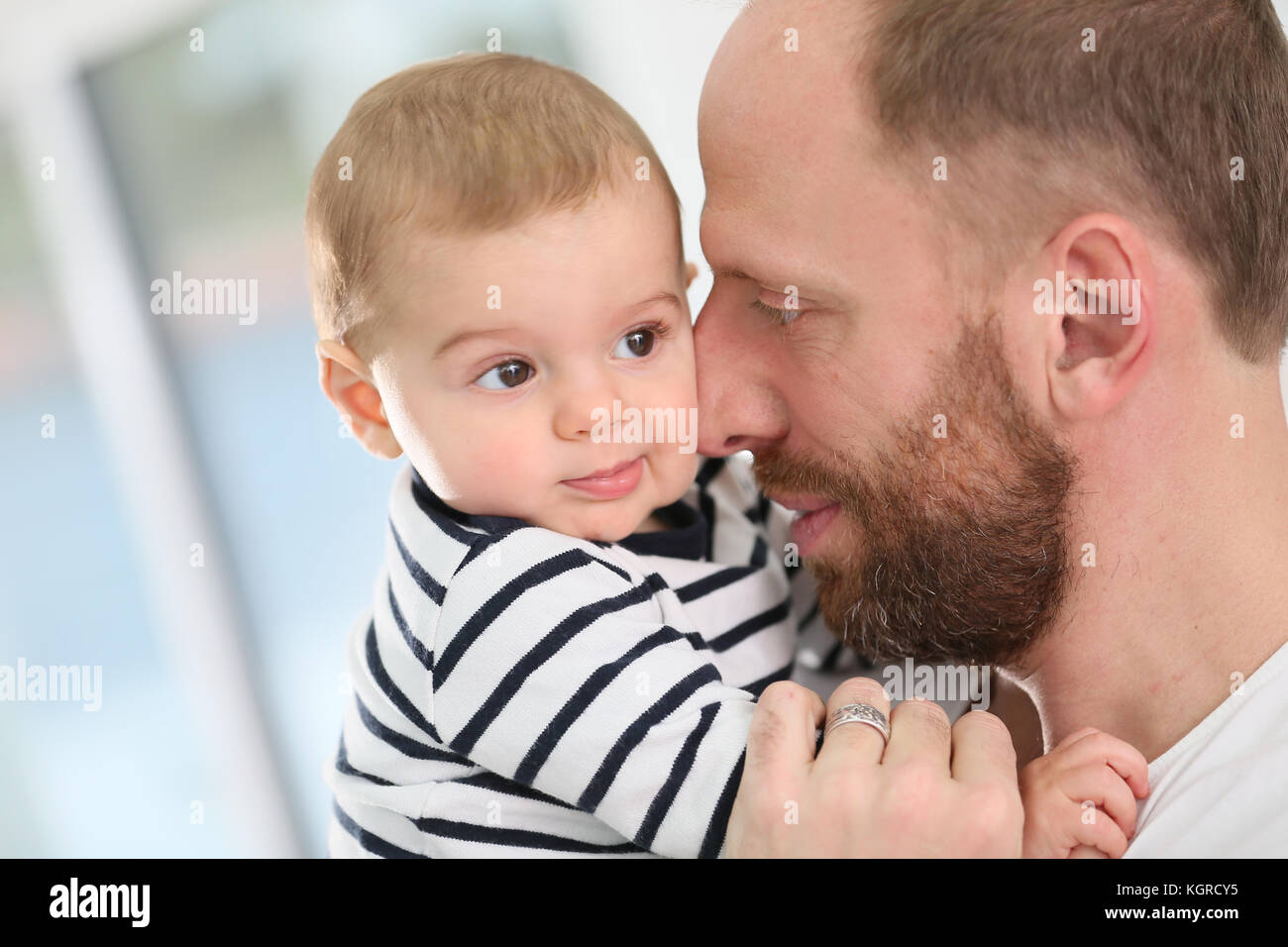 Portrait of daddy embracing baby boy Stock Photo - Alamy