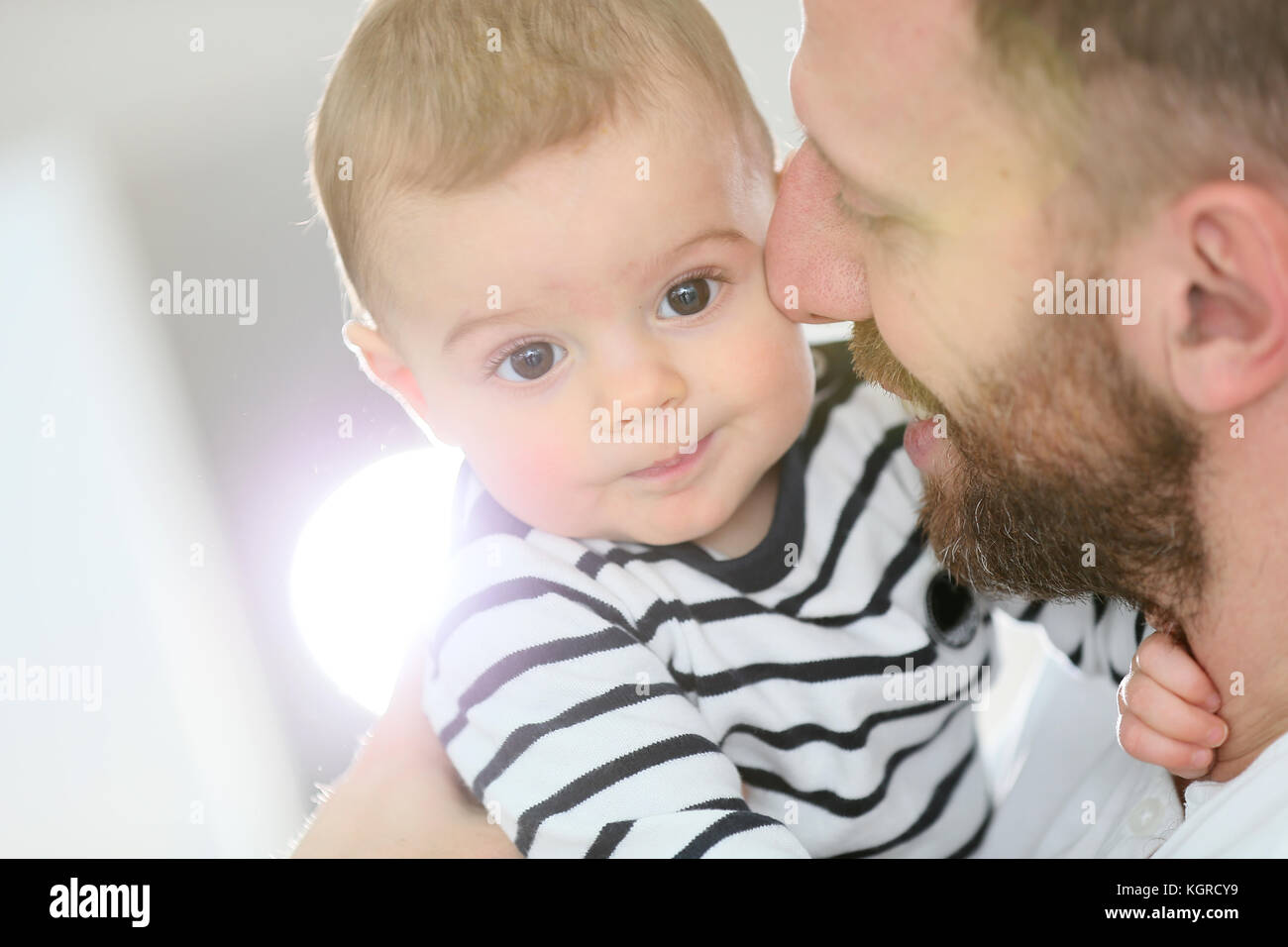 Portrait of daddy embracing baby boy Stock Photo - Alamy
