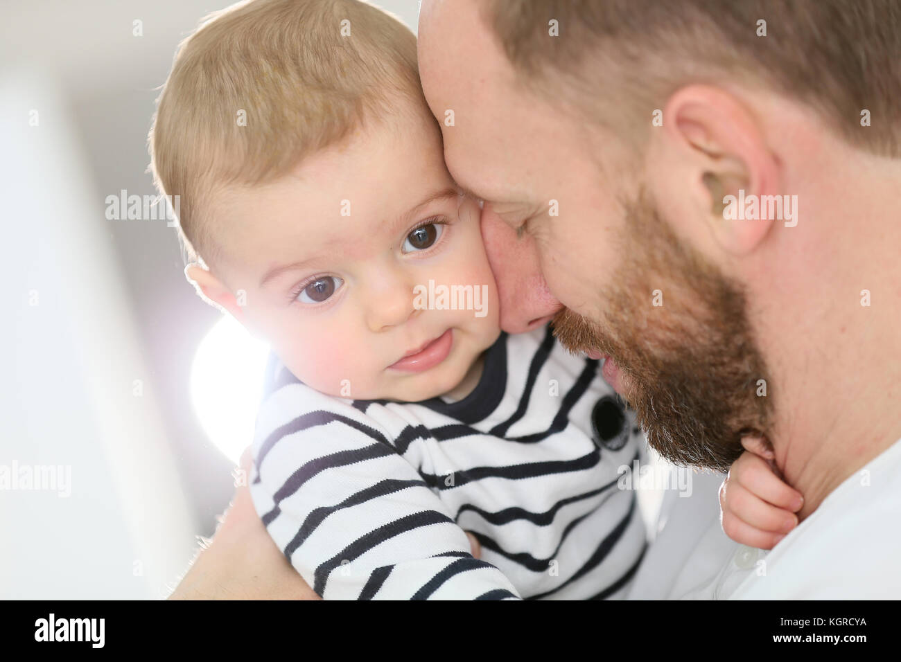 Portrait of daddy embracing baby boy Stock Photo - Alamy