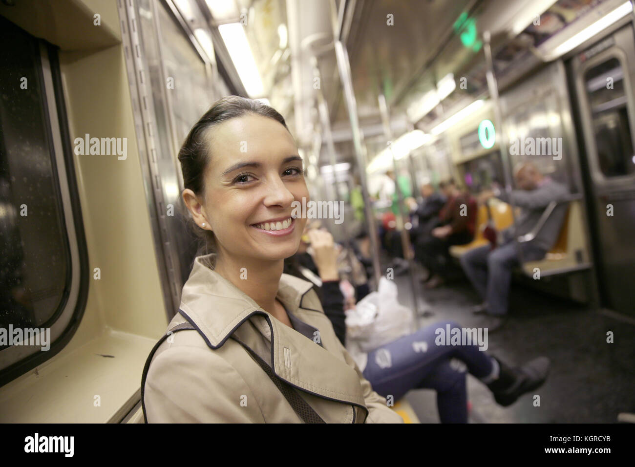 Businesswoman going to work in subway Stock Photo - Alamy