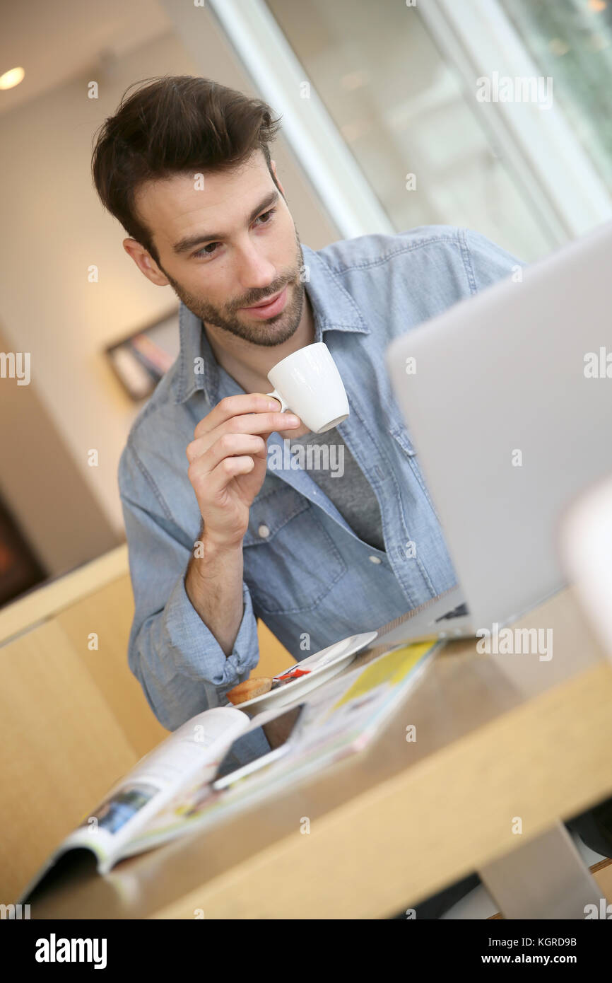 Man working on laptop computer from home Stock Photo - Alamy