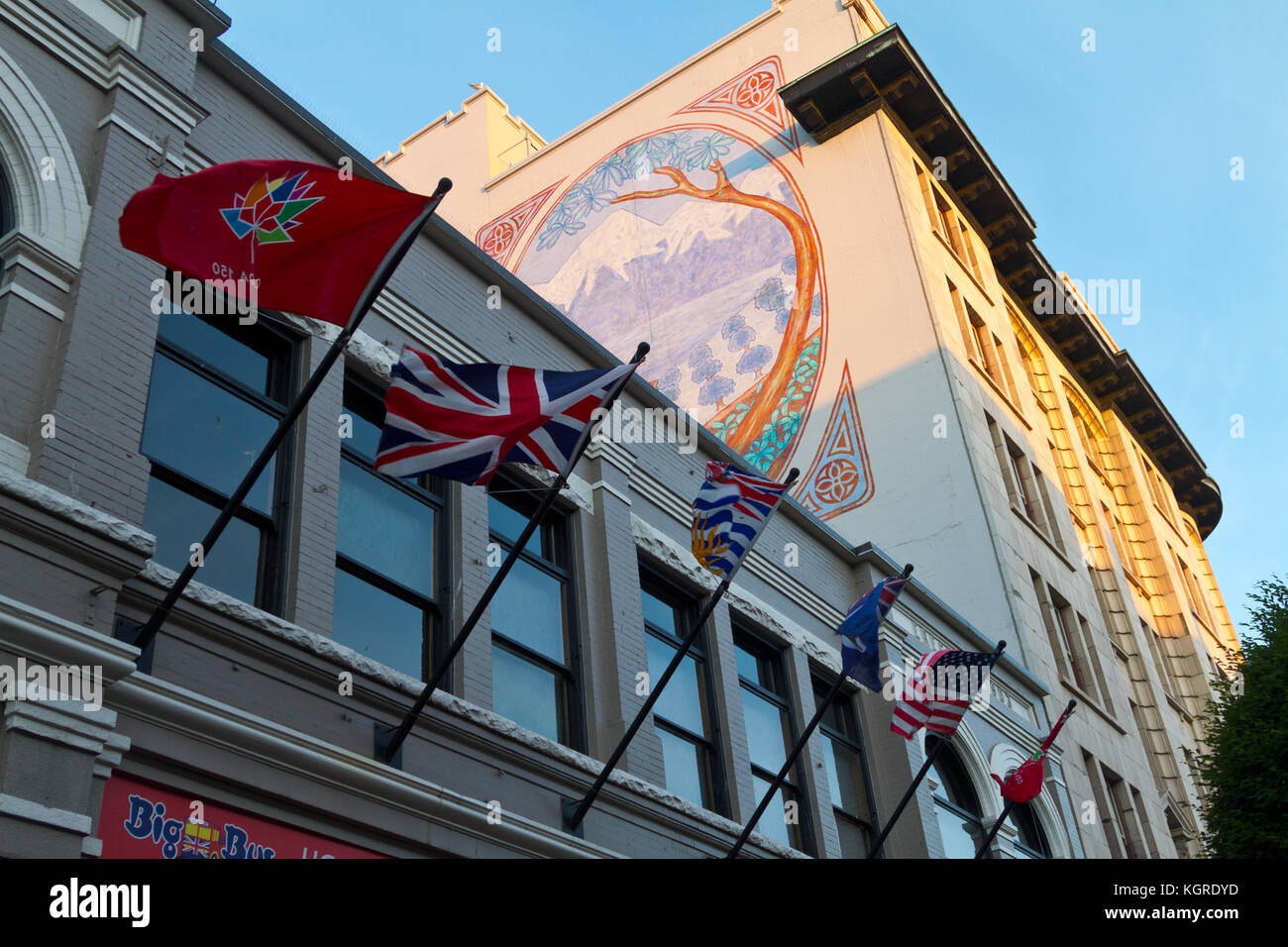 View of downtown buildings with flags in Victoria, British Columbia ...