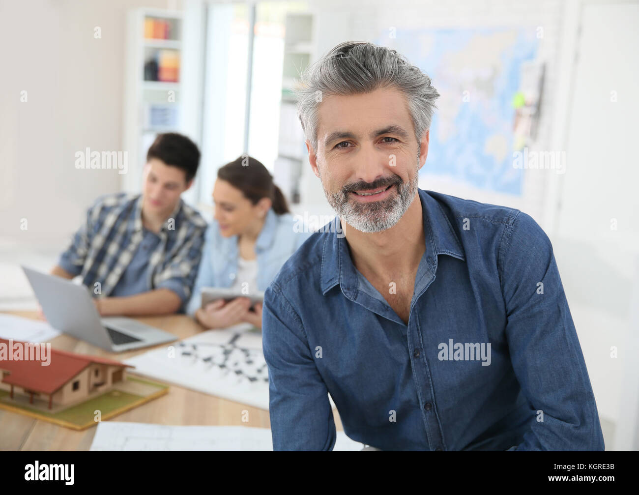 Portrait of smiling teacher in architecture Stock Photo - Alamy
