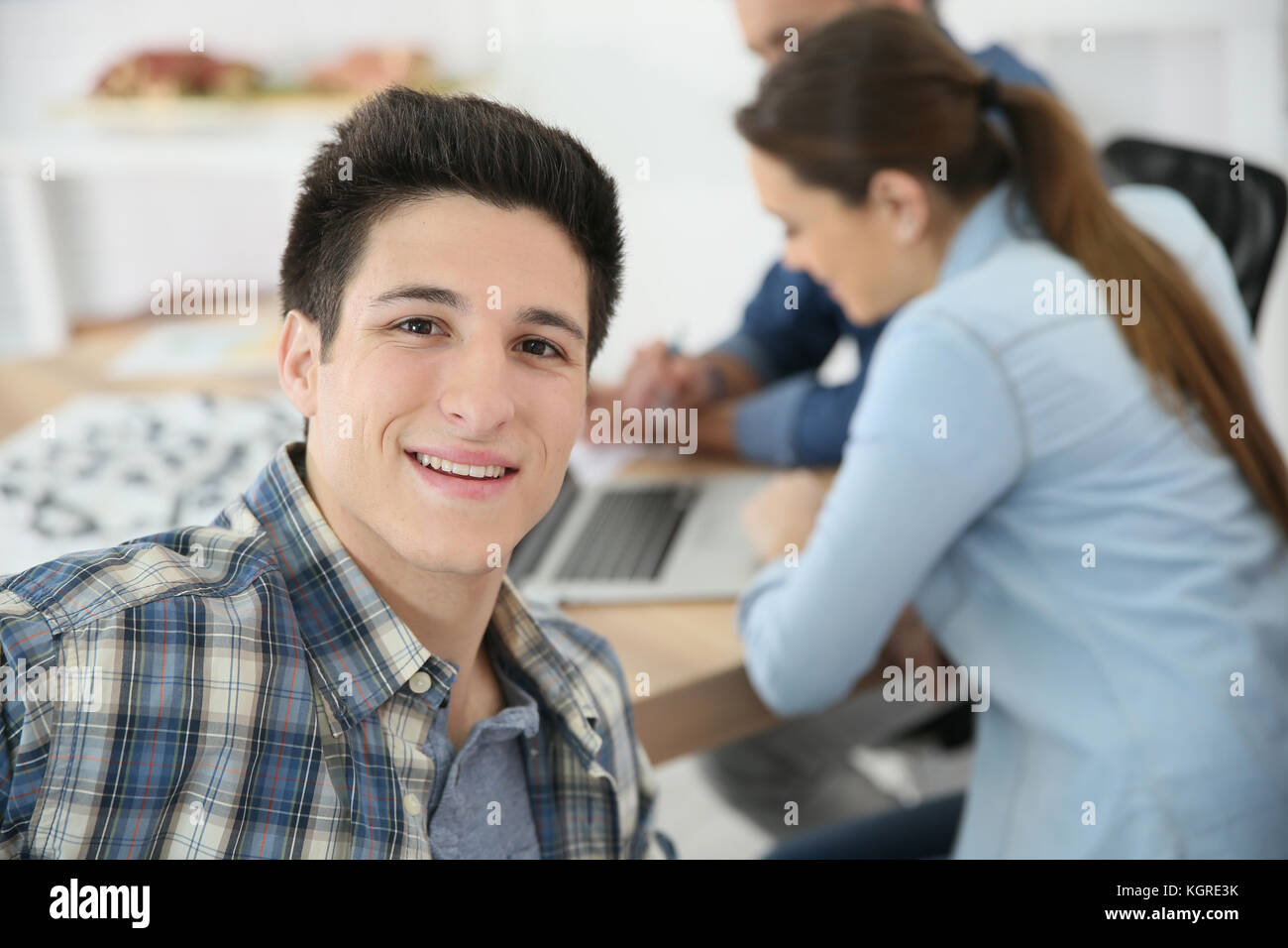 Portrait of college boy attending class Stock Photo - Alamy