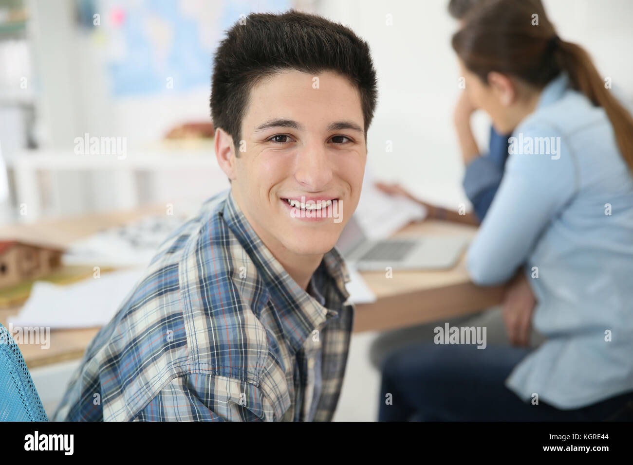 Portrait of college boy attending class Stock Photo - Alamy