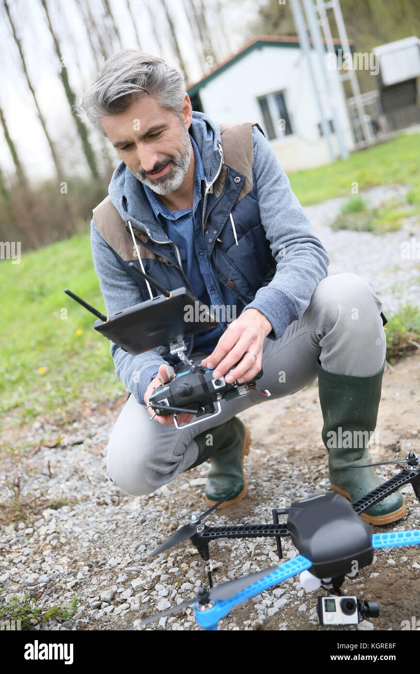 Man operating a drone with remote control Stock Photo - Alamy