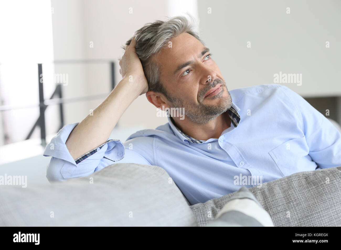 Smiling handsome 45-year-old man relaxing at home Stock Photo - Alamy