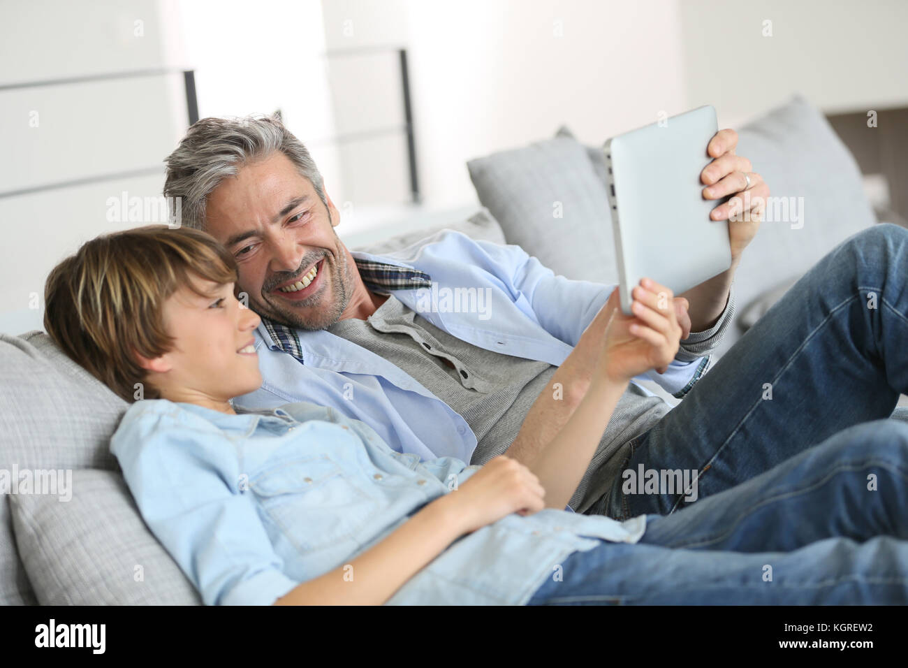 Home father son tablet hi-res stock photography and images - Alamy