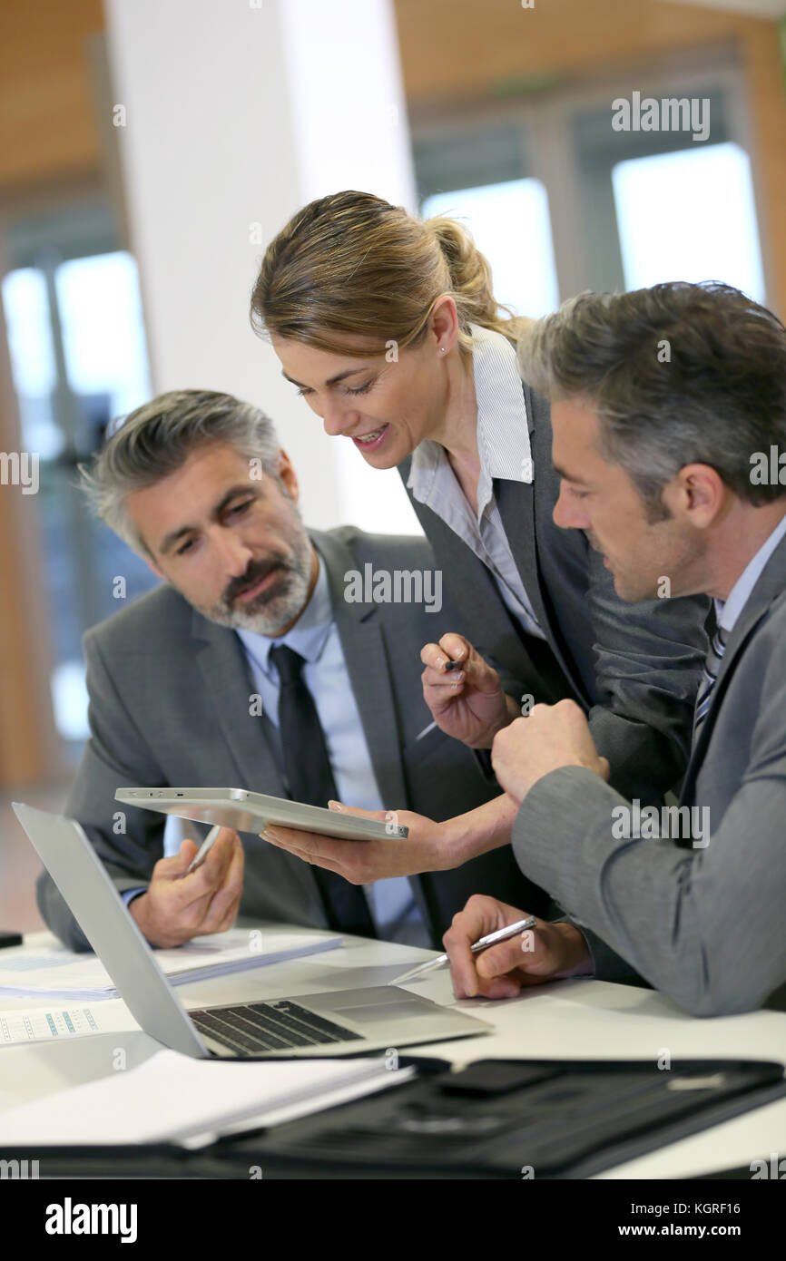 Business partners working together in office Stock Photo - Alamy