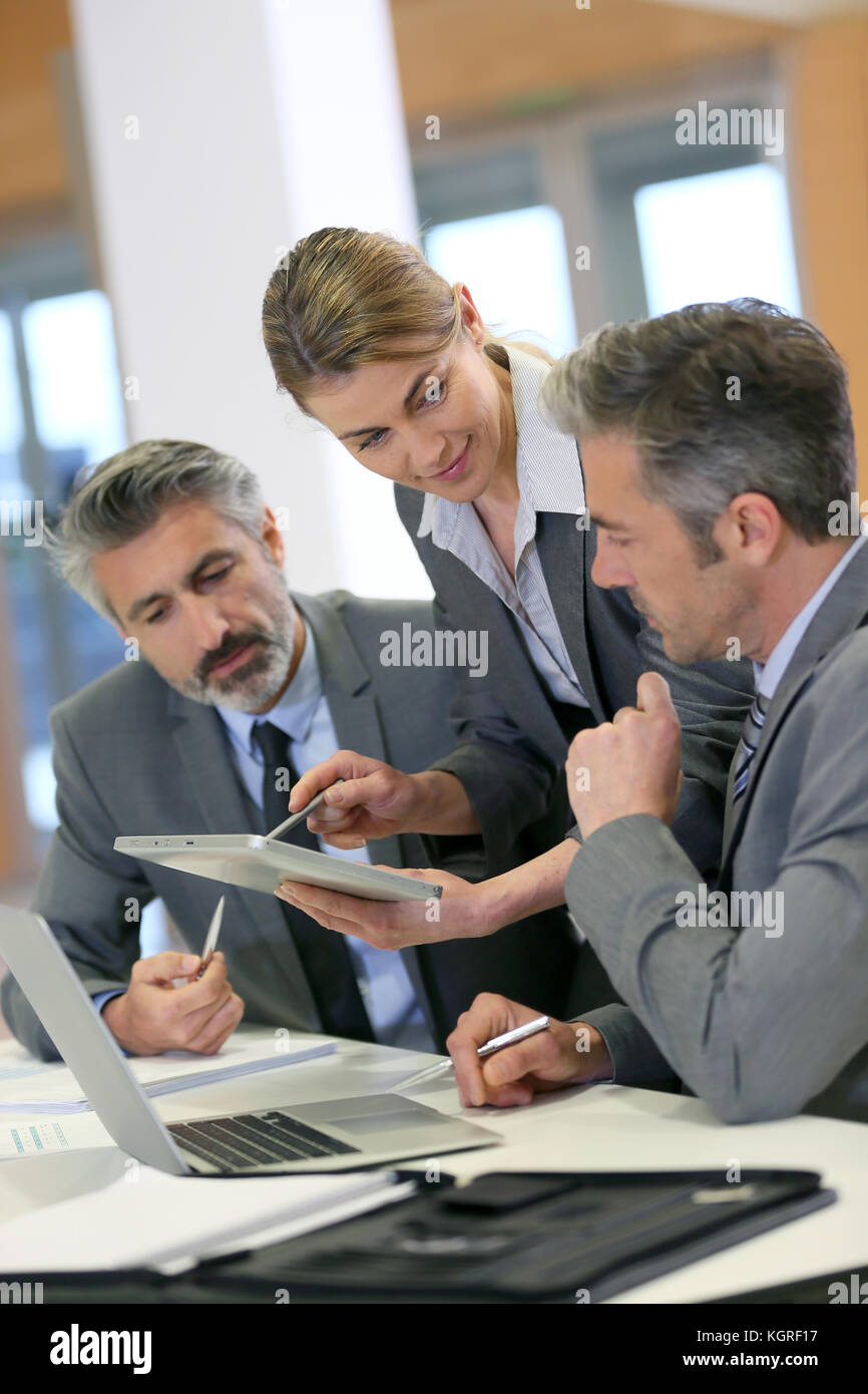 Business partners working together in office Stock Photo - Alamy