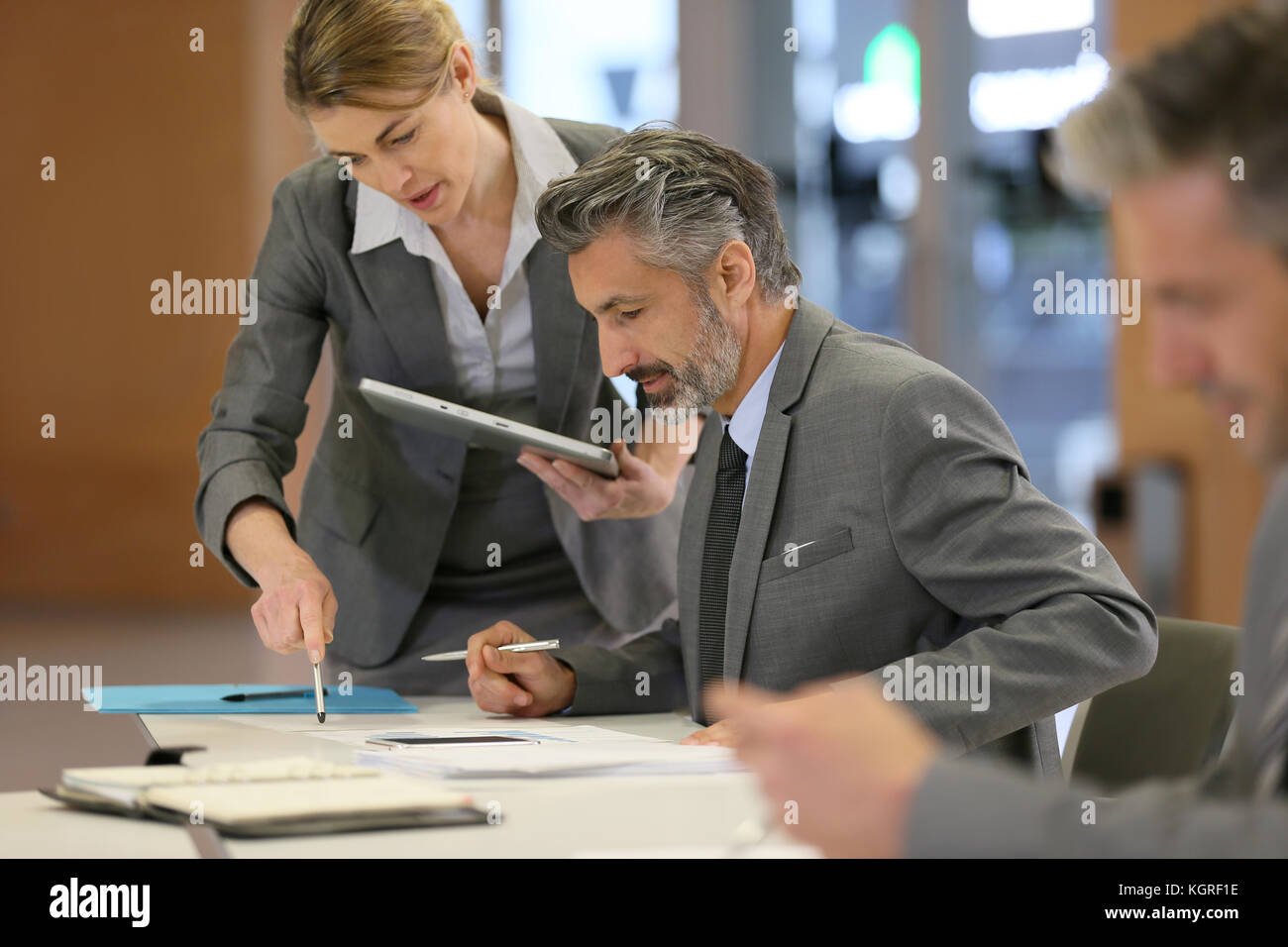 Business partners working together in office Stock Photo - Alamy