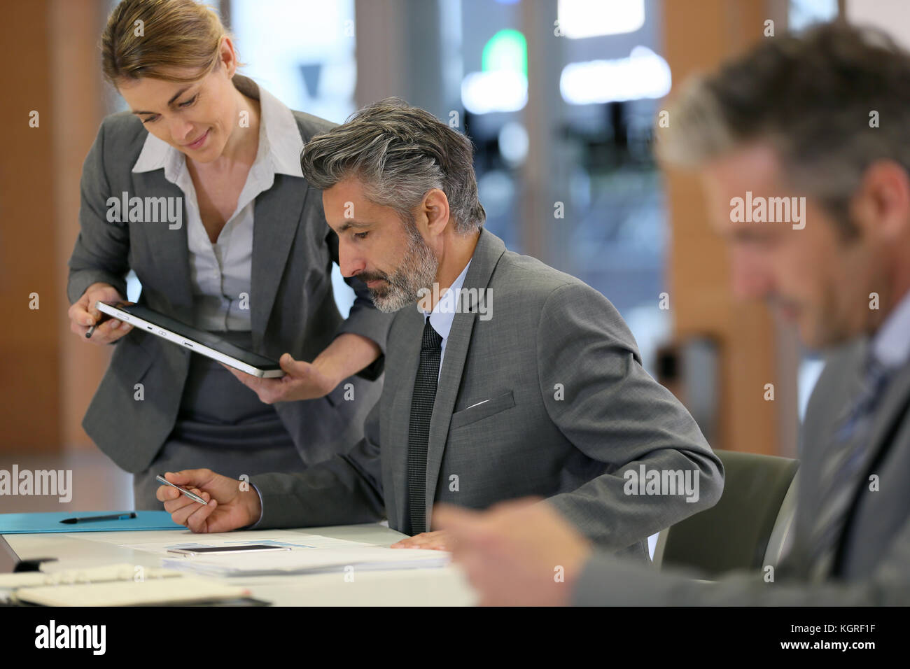 Business partners working together in office Stock Photo - Alamy