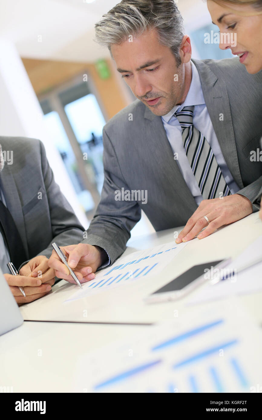 Business people working on budget strategy Stock Photo - Alamy