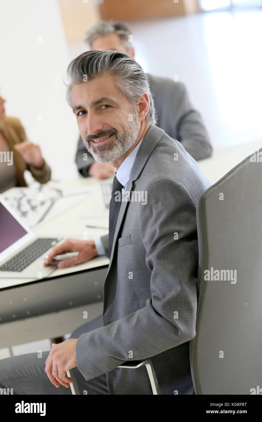 Portrait of architect meeting with clients in office Stock Photo - Alamy