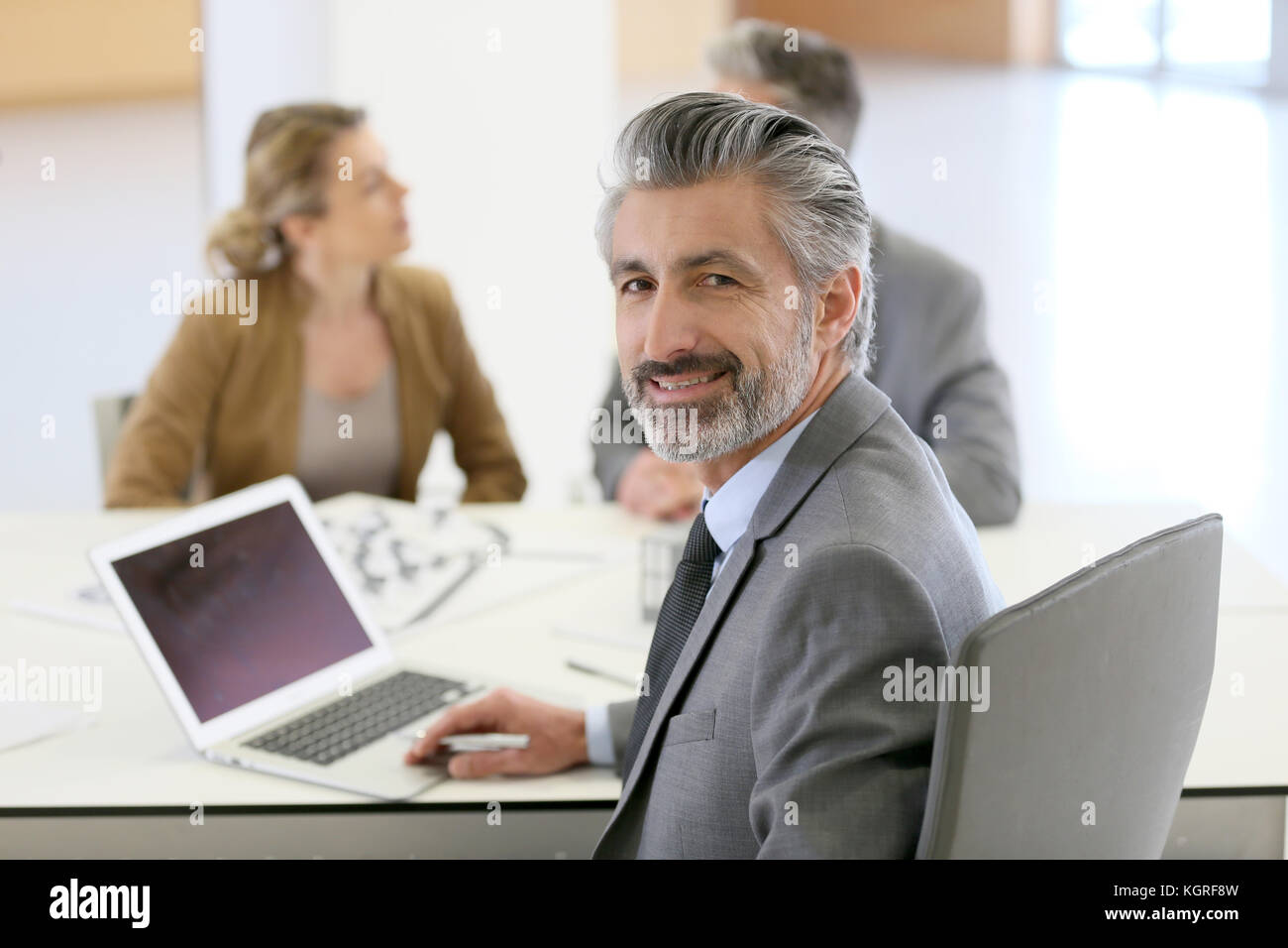 Portrait of architect meeting with clients in office Stock Photo - Alamy