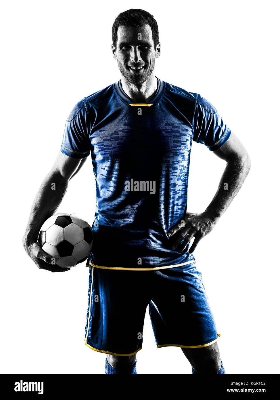 one caucasian soccer player man standing smiling in silhouette isolated ...