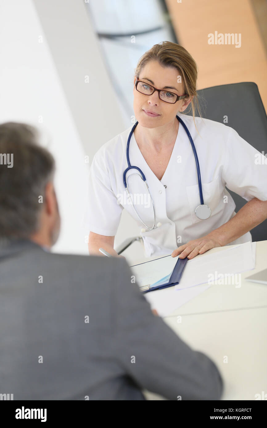 Doctor meeting with patient in hospital office Stock Photo - Alamy