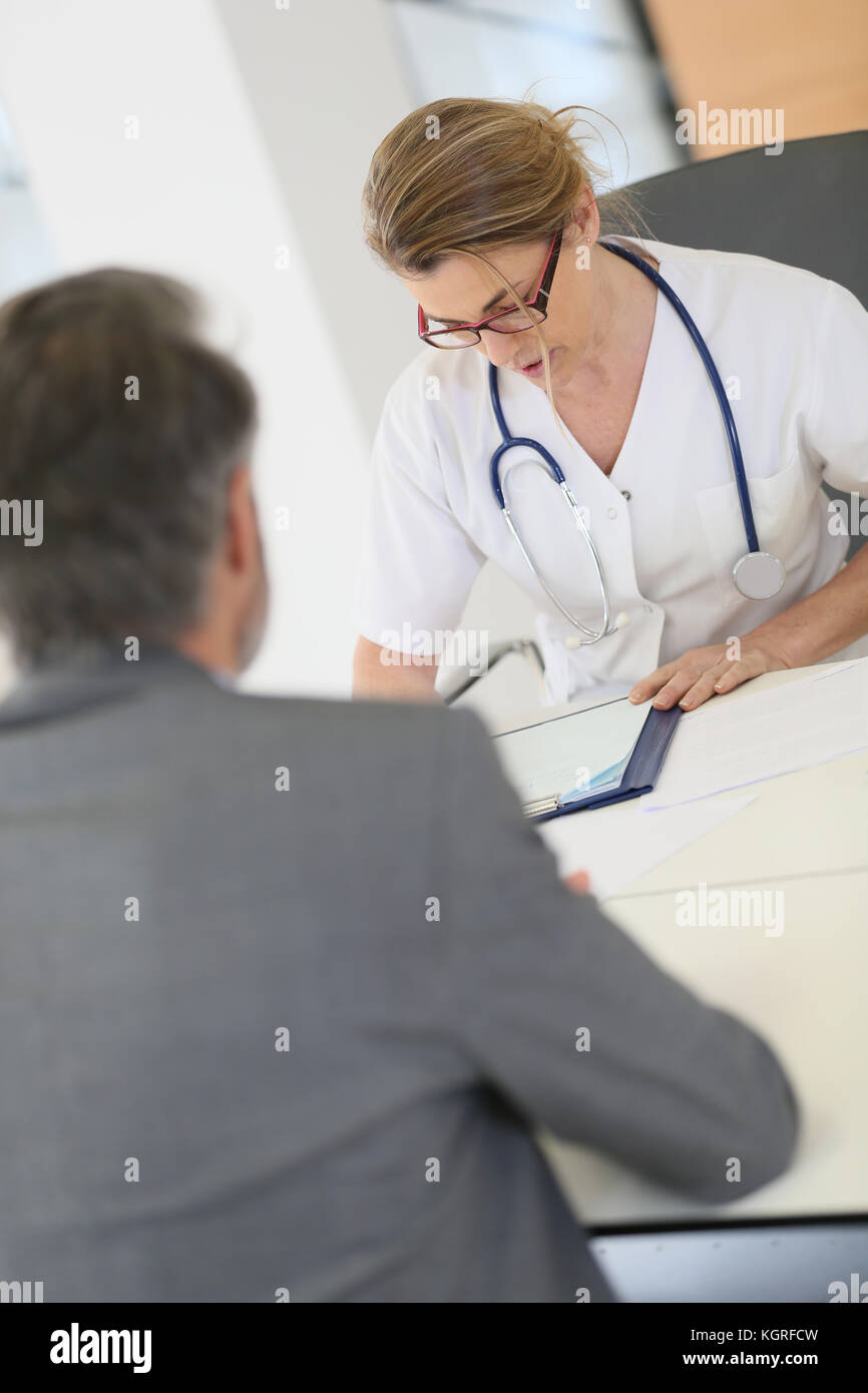 Doctor meeting with patient in hospital office Stock Photo - Alamy