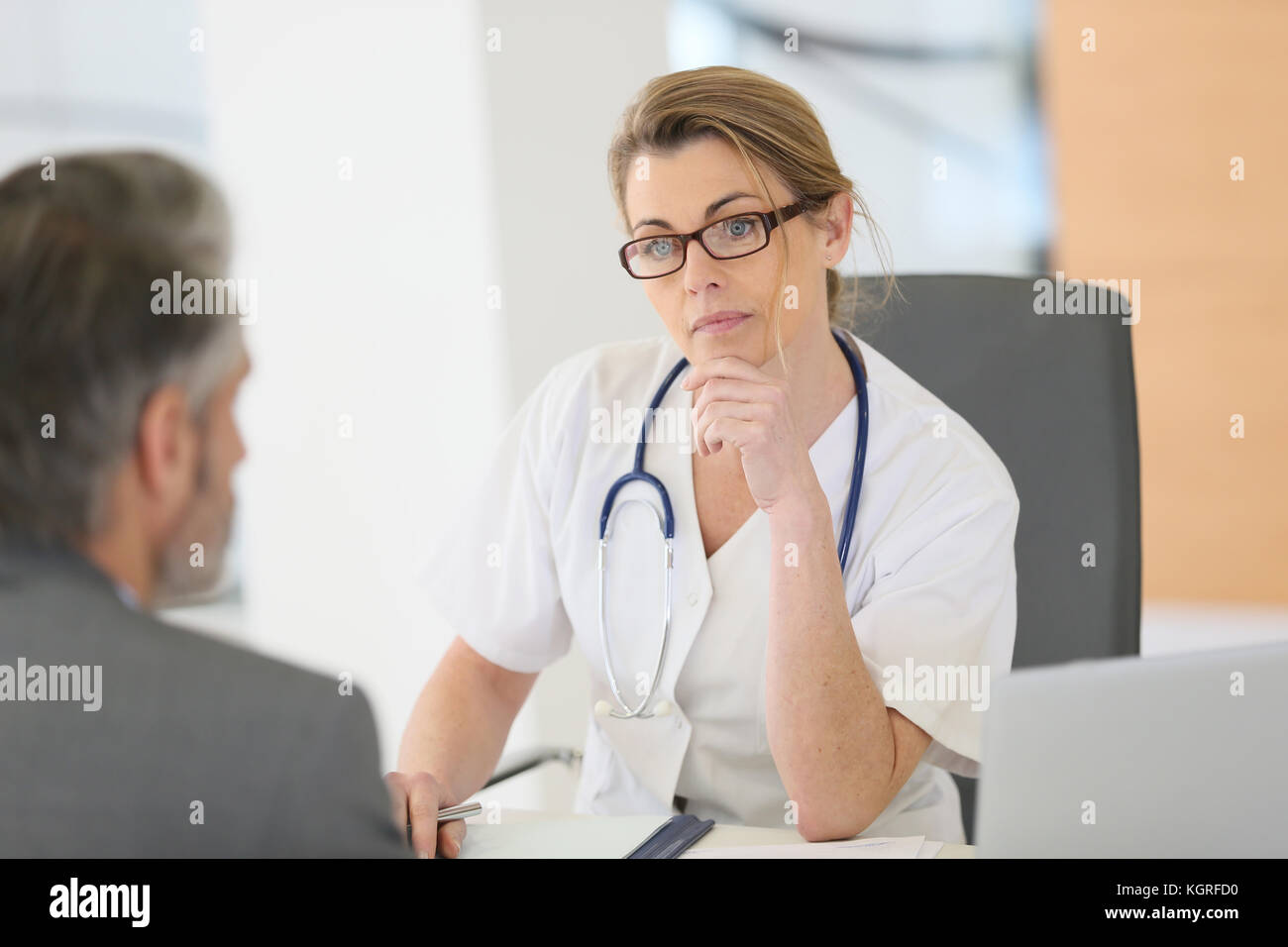 Doctor meeting with patient in hospital office Stock Photo - Alamy