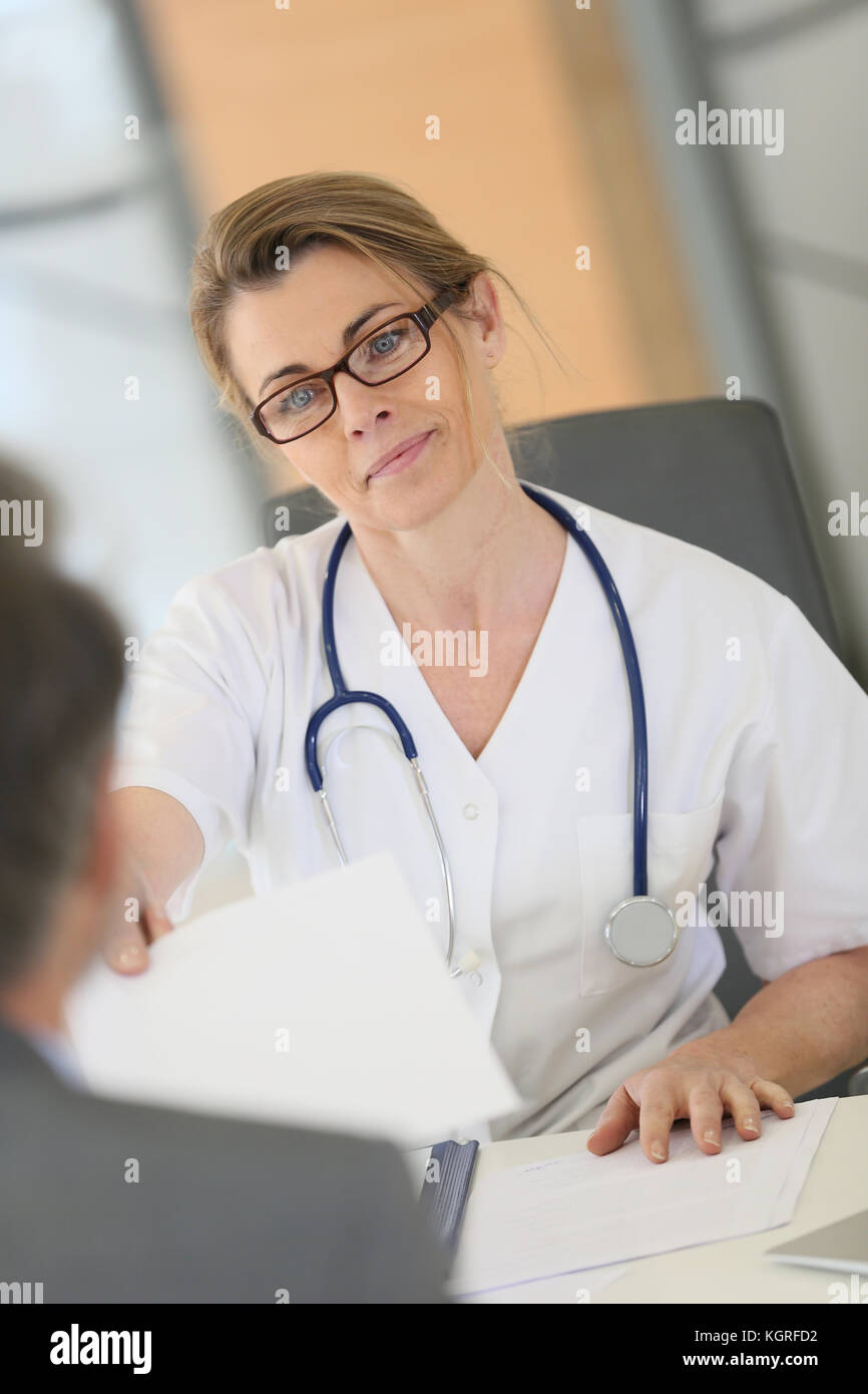 Doctor meeting with patient in hospital office Stock Photo - Alamy