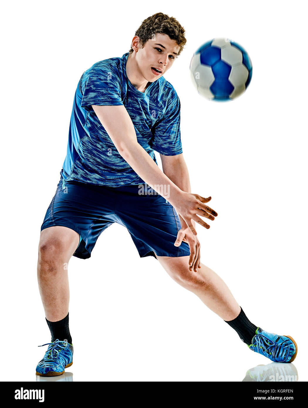 one caucasian handball player teenager boy in studio isolated on white ...