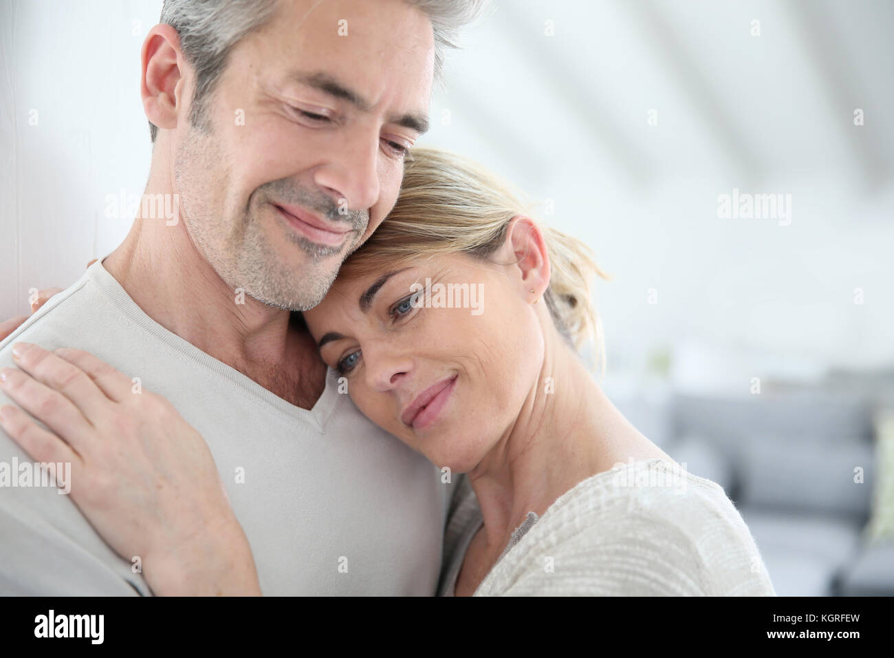 Mature couple embracing with love and tenderness Stock Photo - Alamy