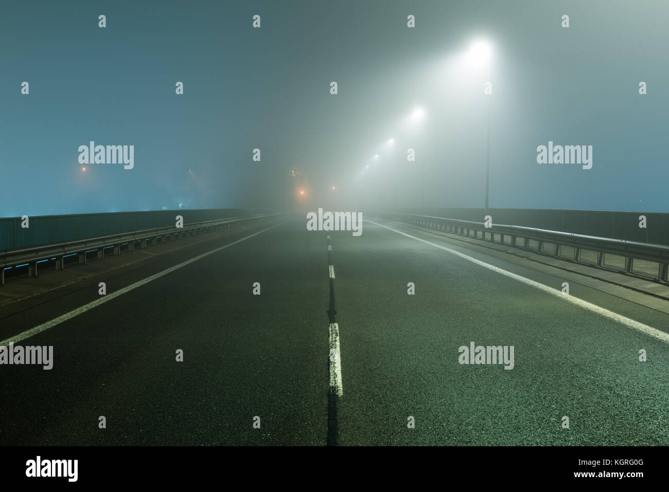 Middle Of The Road During Night Illuminated Stock Photo - Alamy