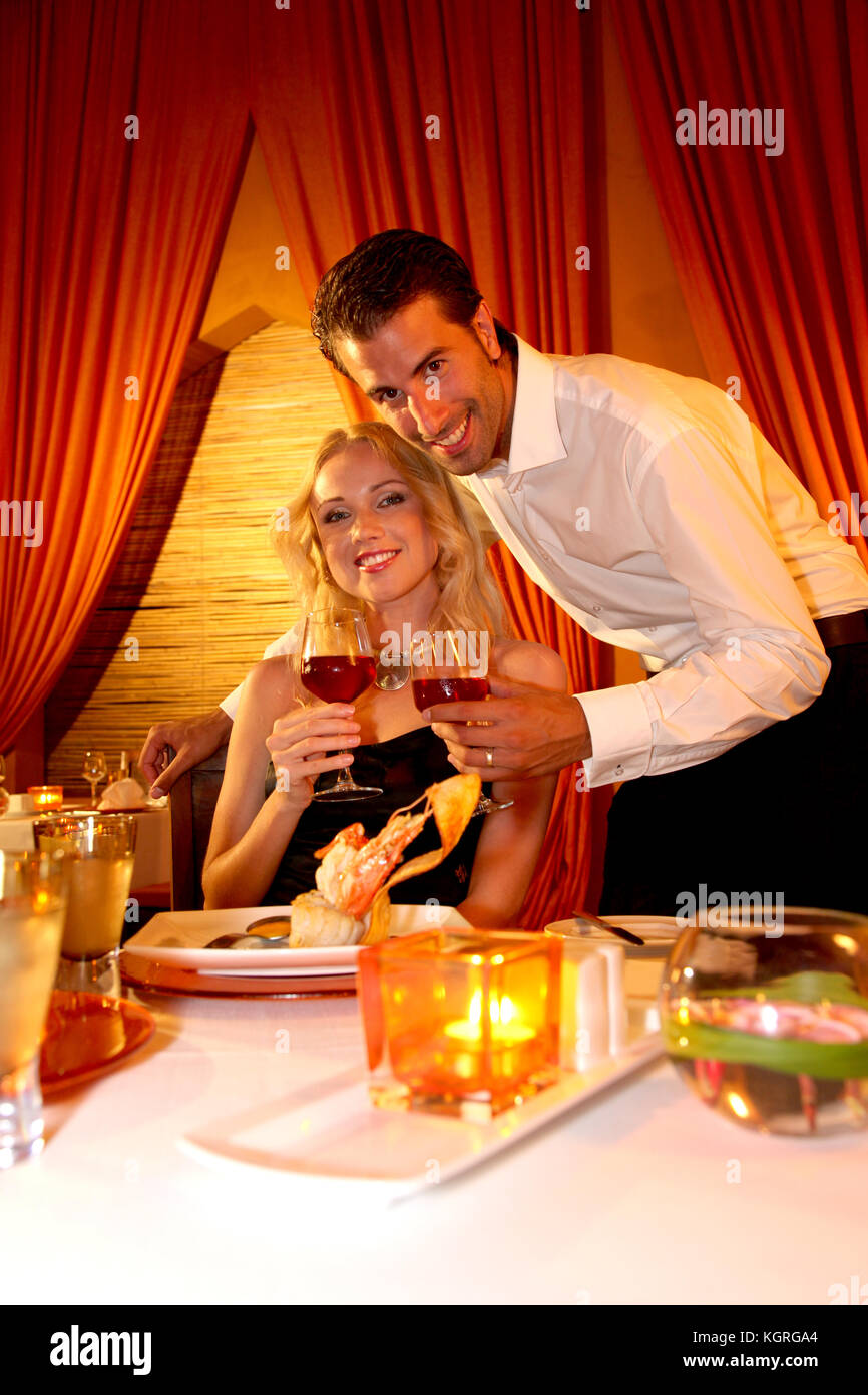 Couple dining in a fancy restaurant Stock Photo - Alamy