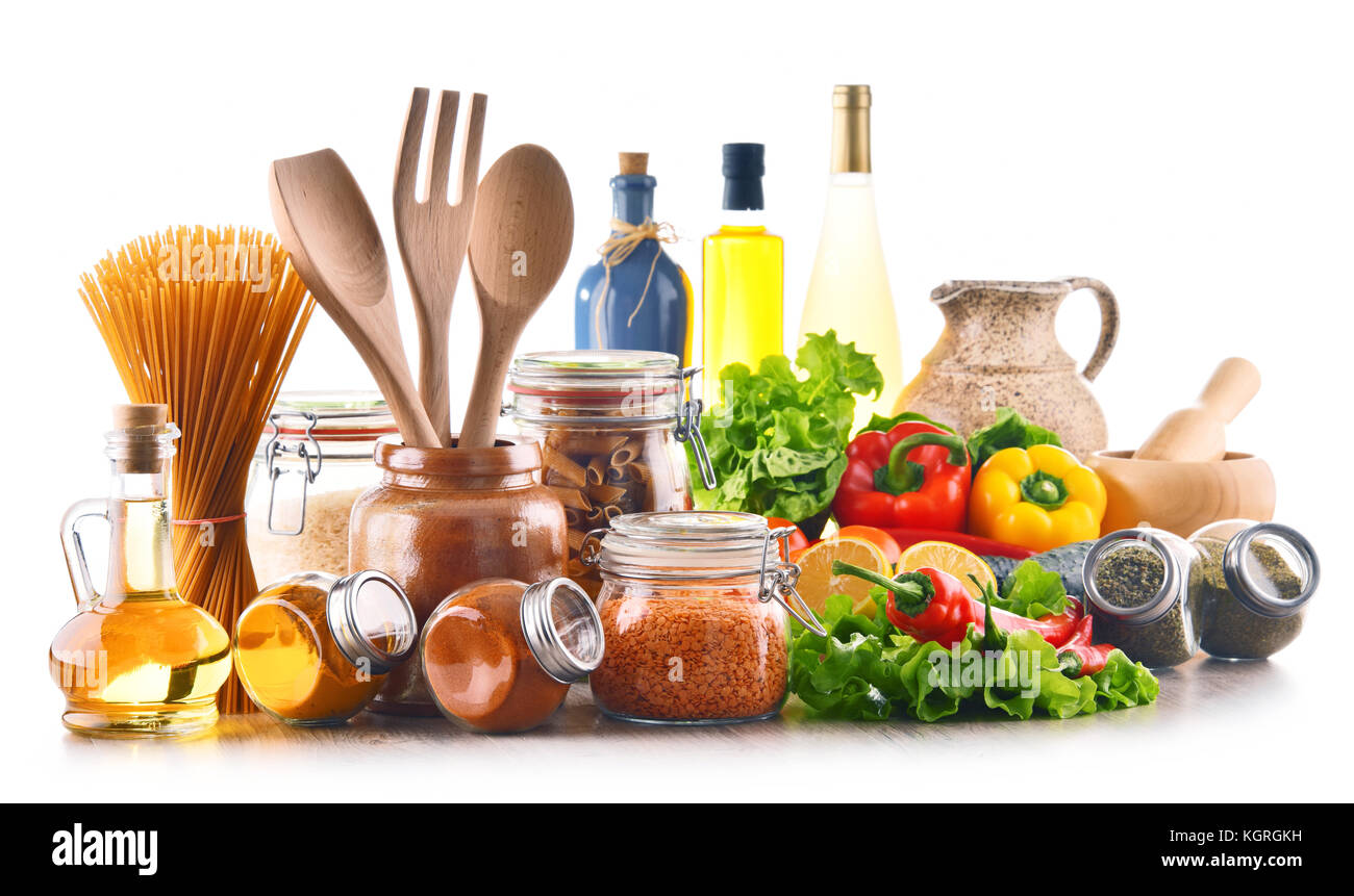 Assorted food products and kitchen utensils isolated on white ...