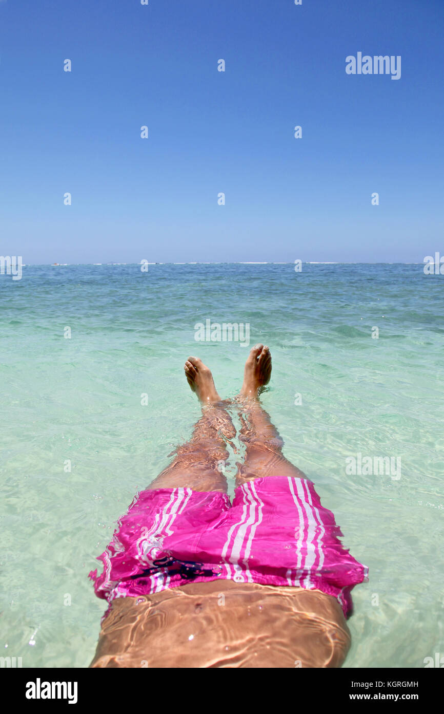 Closeup of man's feet floating in blue lagoon water Stock Photo - Alamy